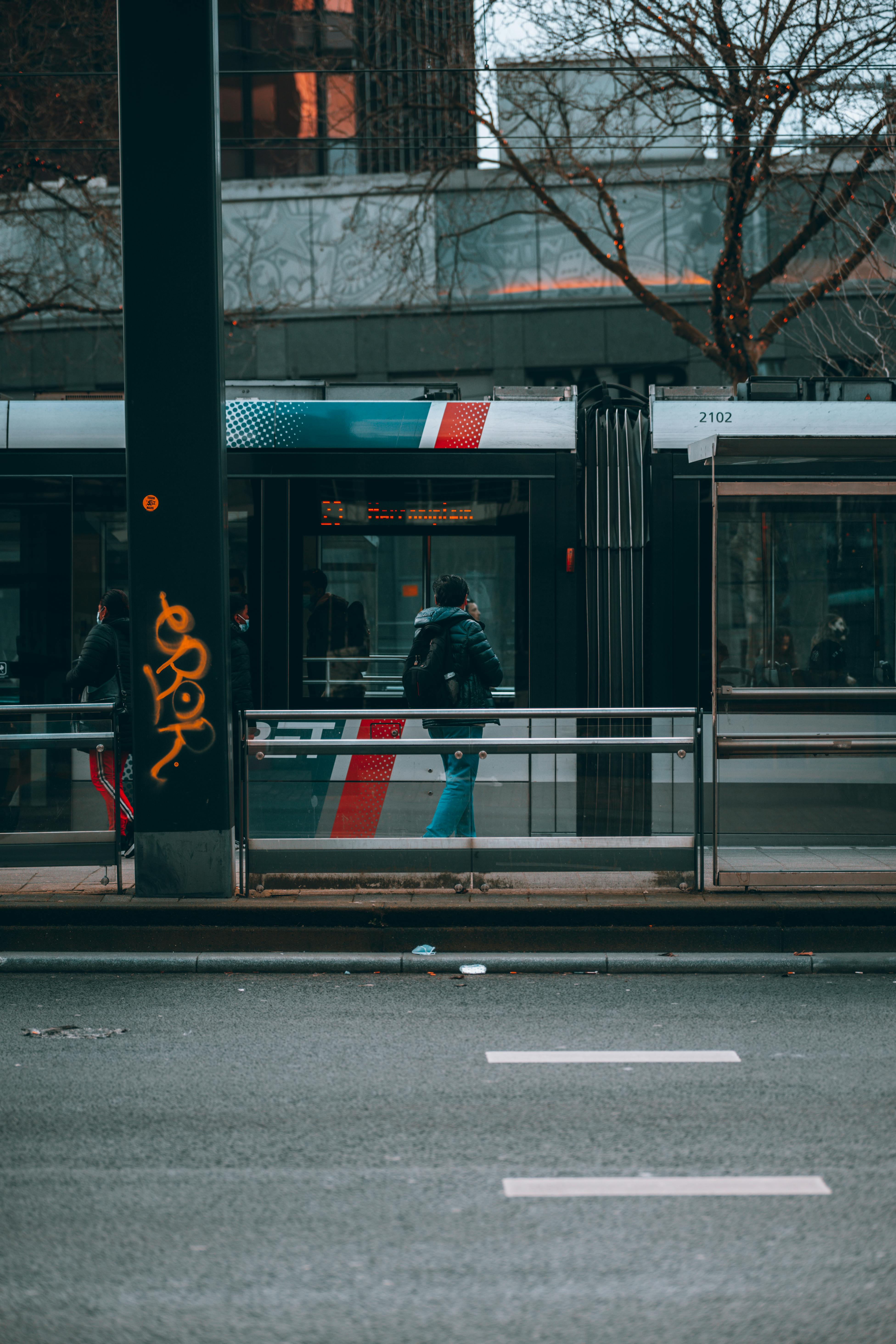 Man on City Street getting into Bus · Free Stock Photo