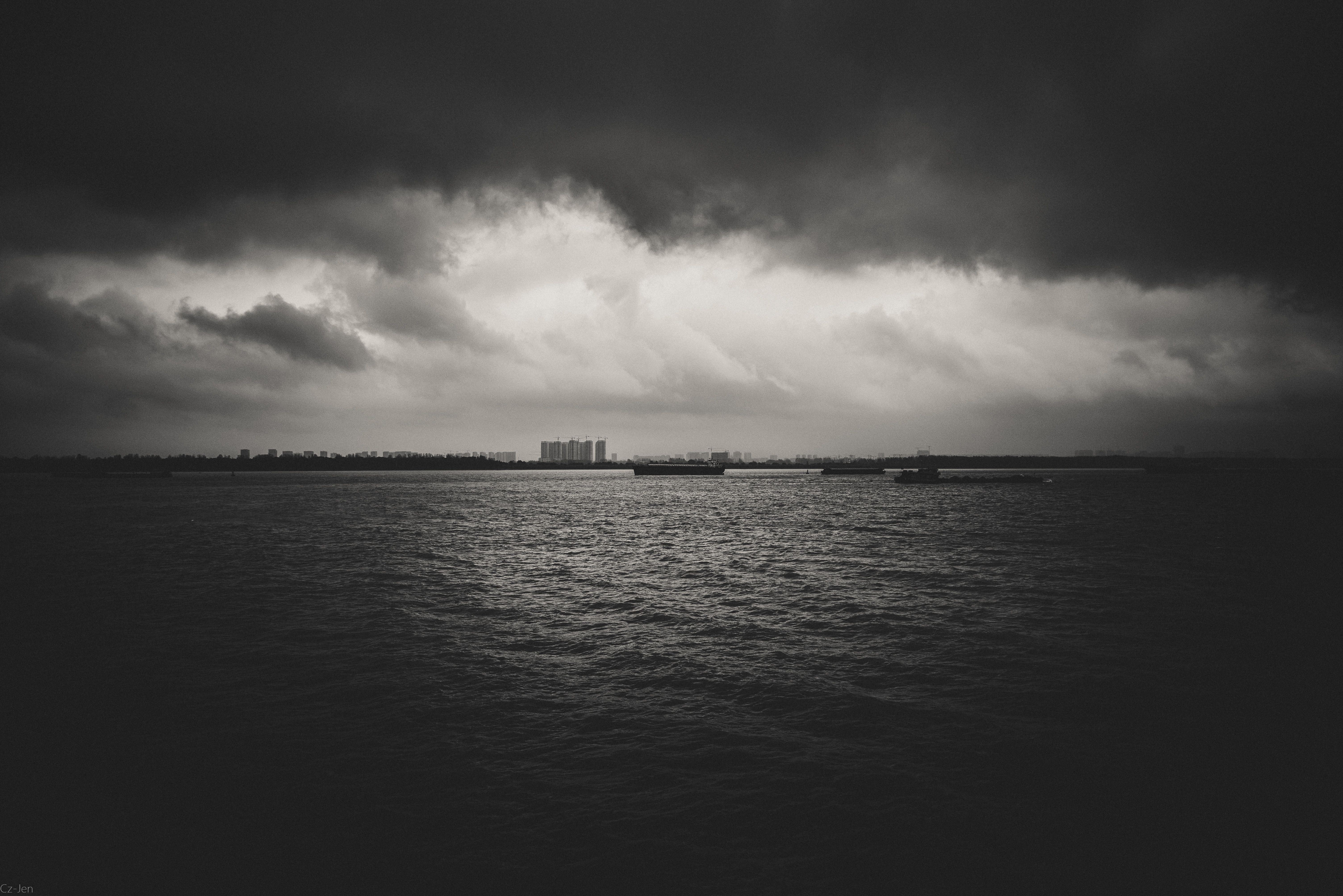 Grayscale Photo of Storm Clouds on Sea · Free Stock Photo