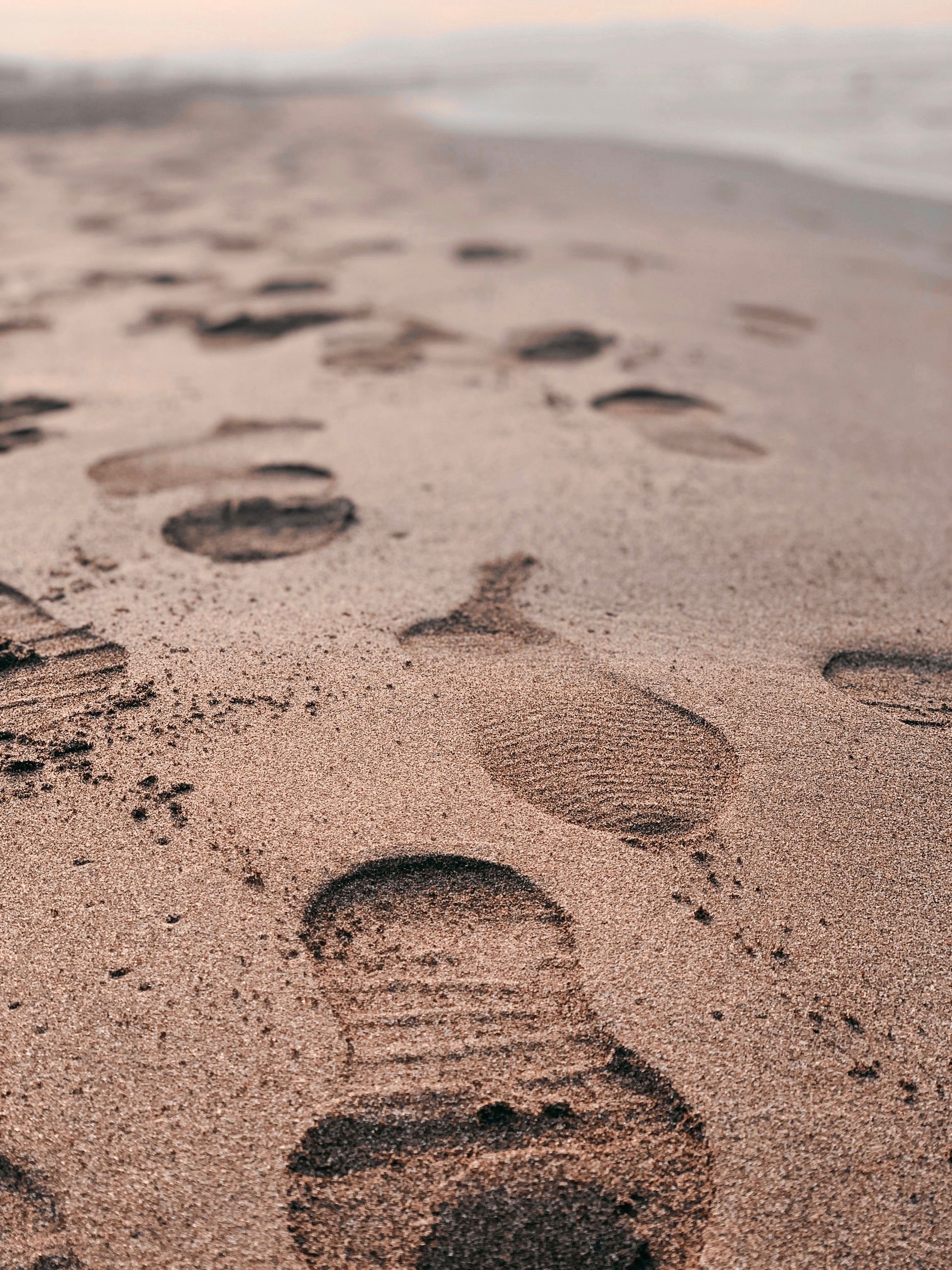 Footprints in Brown Sand · Free Stock Photo