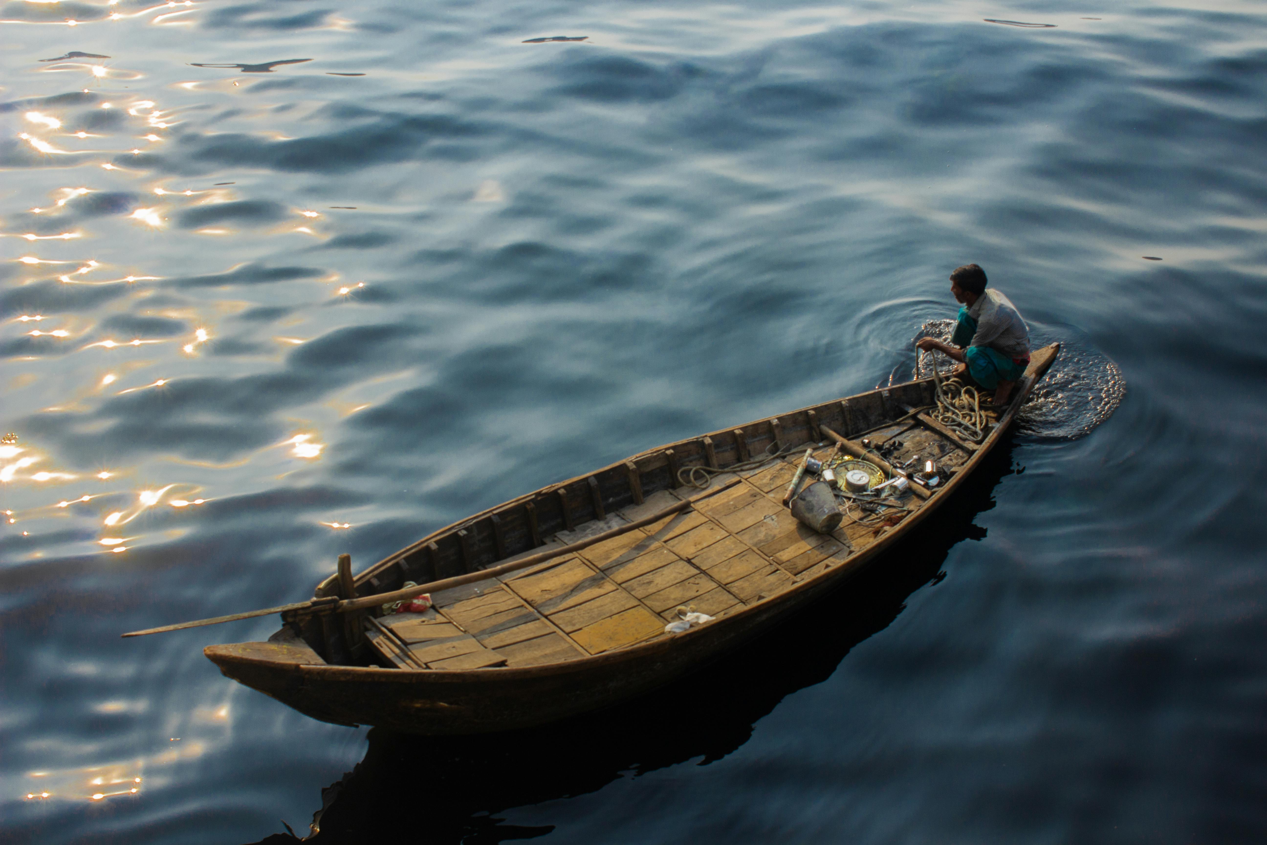 A Man Fishing on a Boat · Free Stock Photo