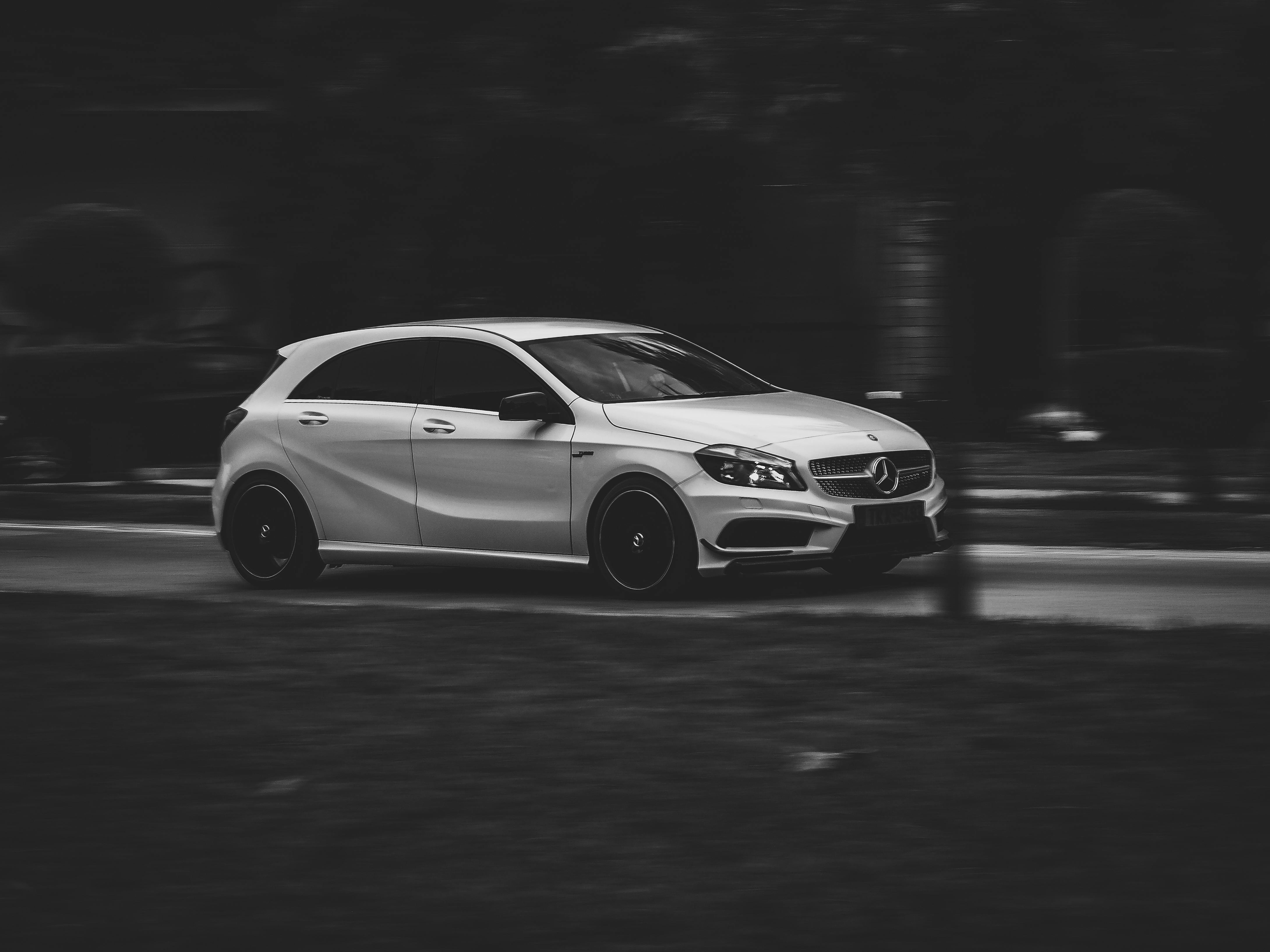 Grayscale Photo of Semi Trailer Truck on the Road · Free Stock Photo