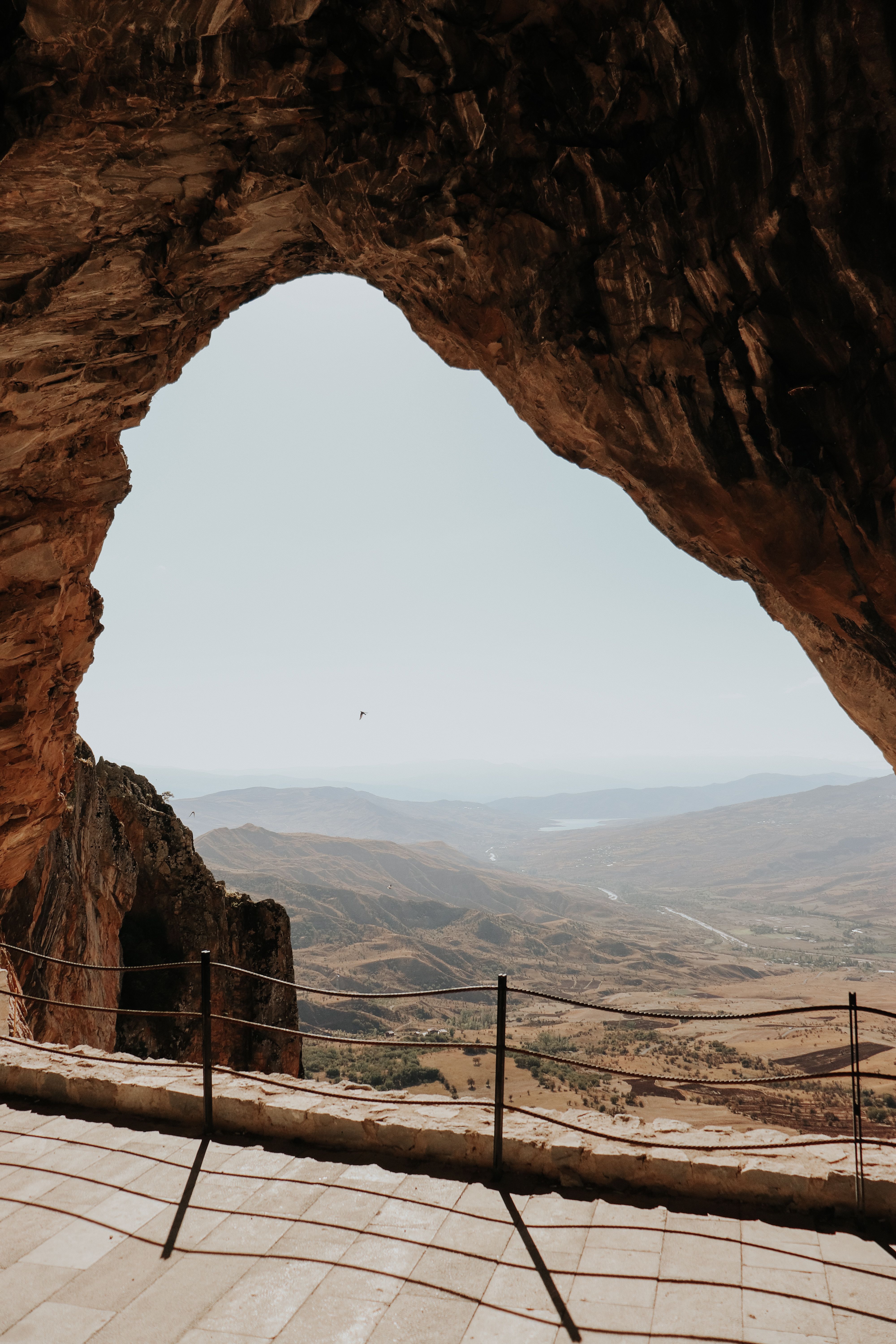 Terrace under a Natural Arch · Free Stock Photo