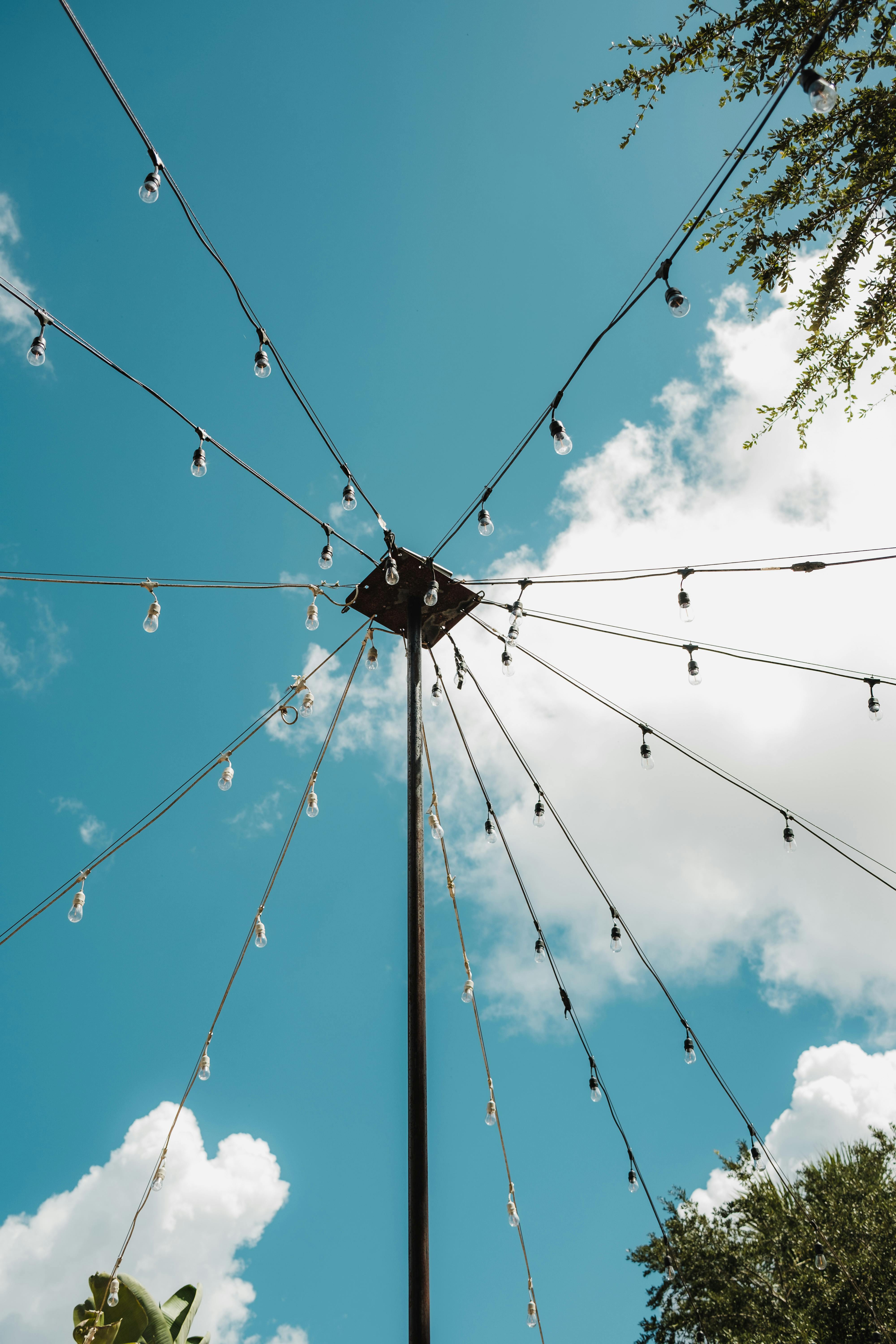 String of Light Bulbs on a Pole · Free Stock Photo