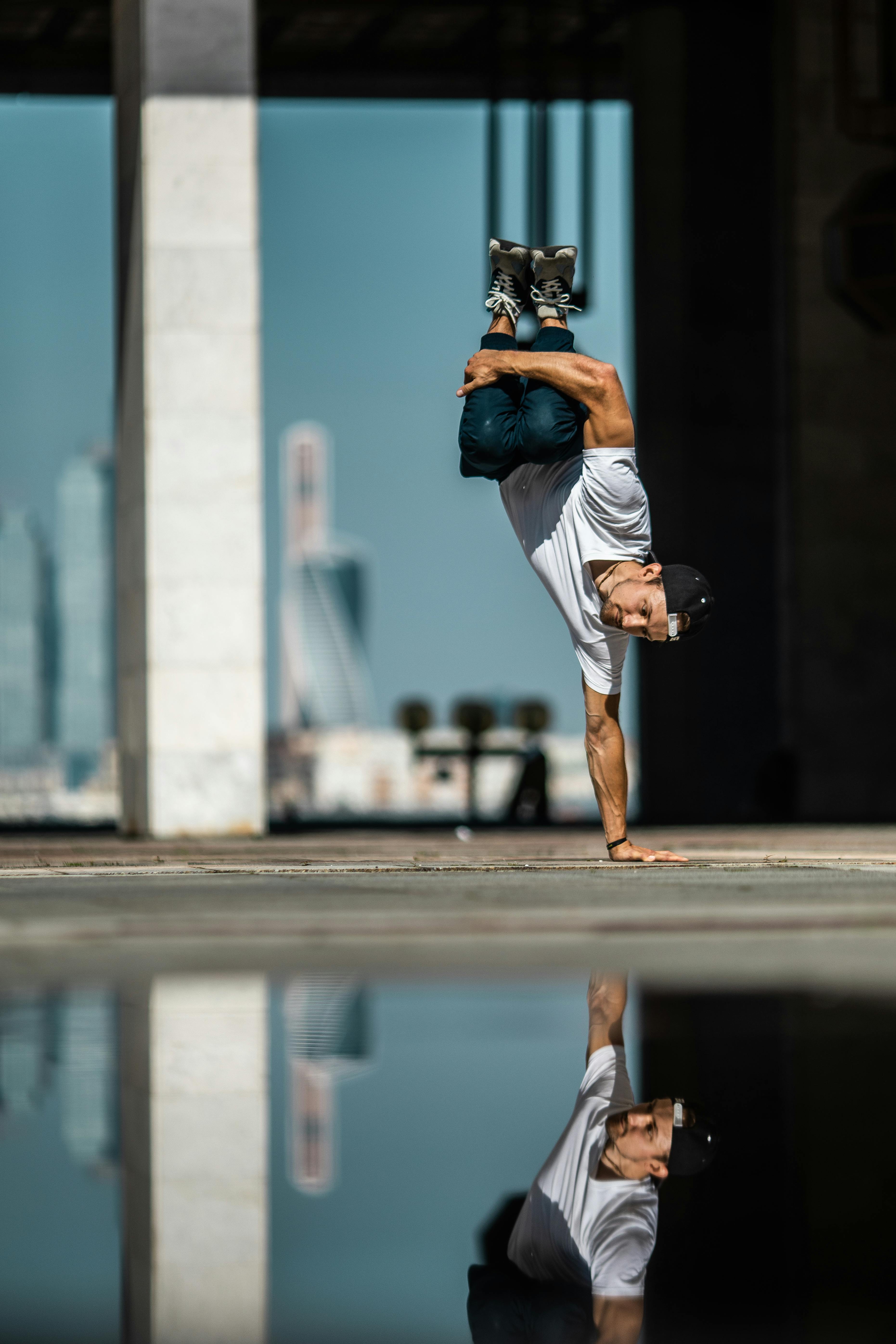 A Man Doing Handstand Using One Hand · Free Stock Photo