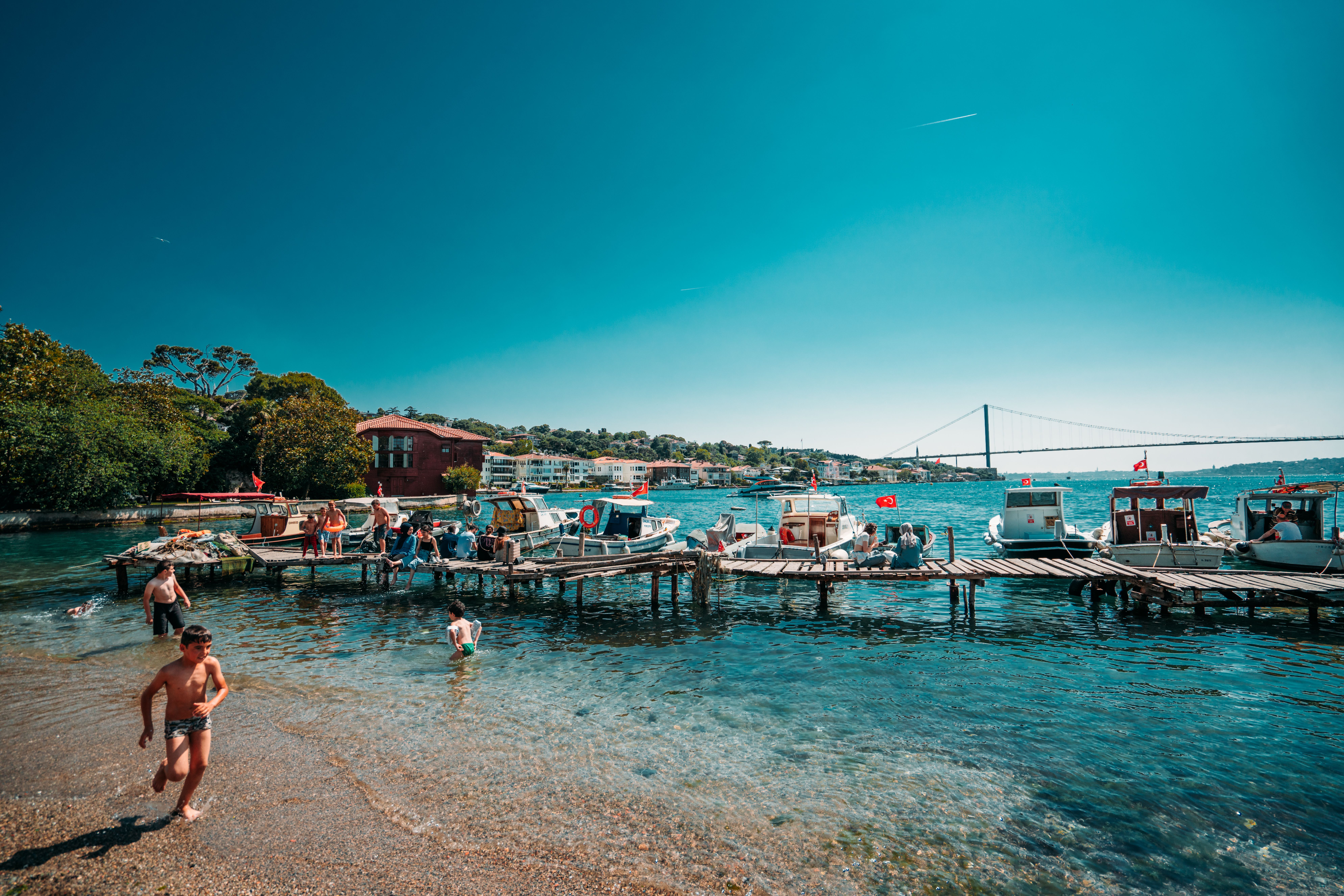Photograph of People and Boats on a Dock · Free Stock Photo