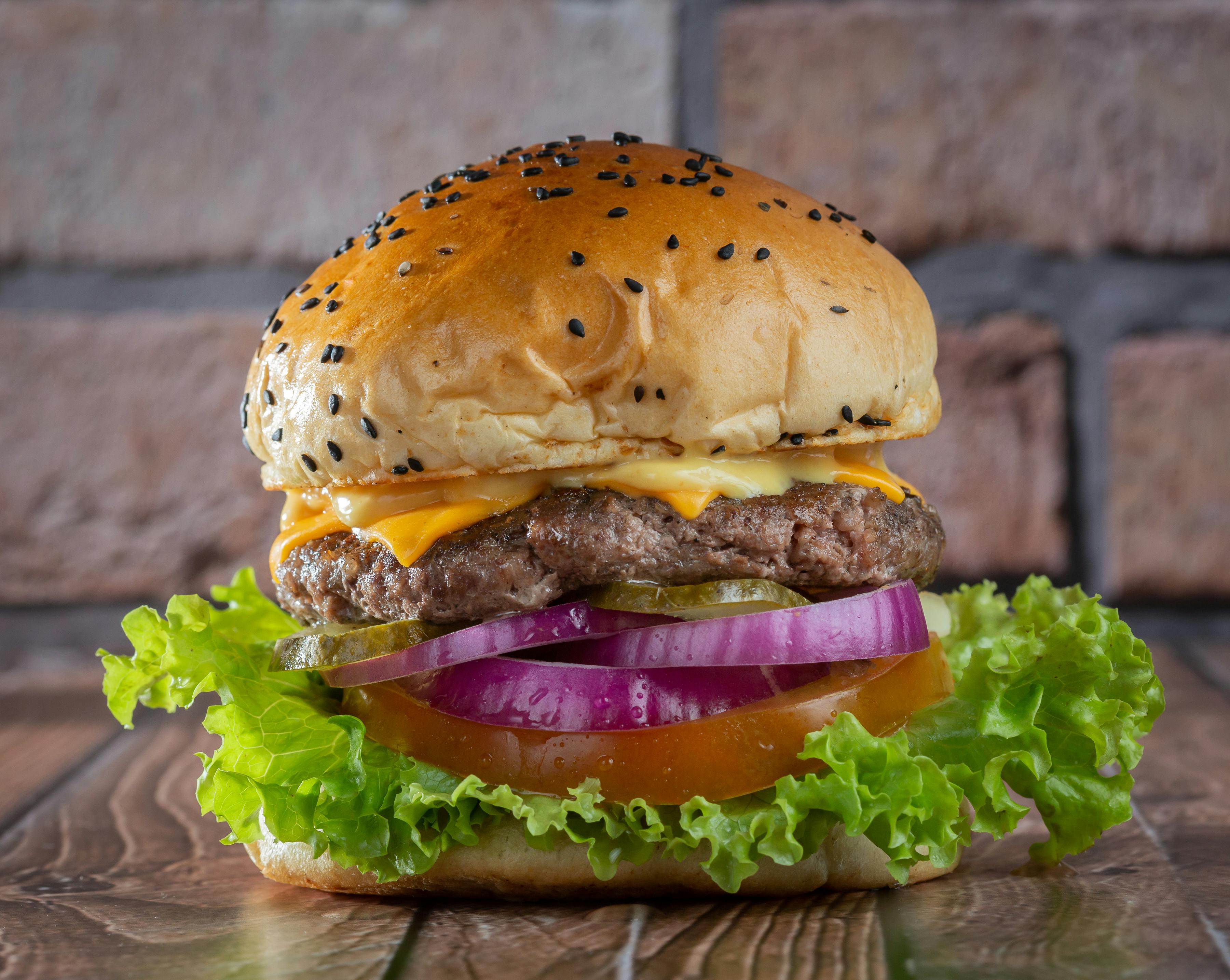 Cheeseburger on Table · Free Stock Photo