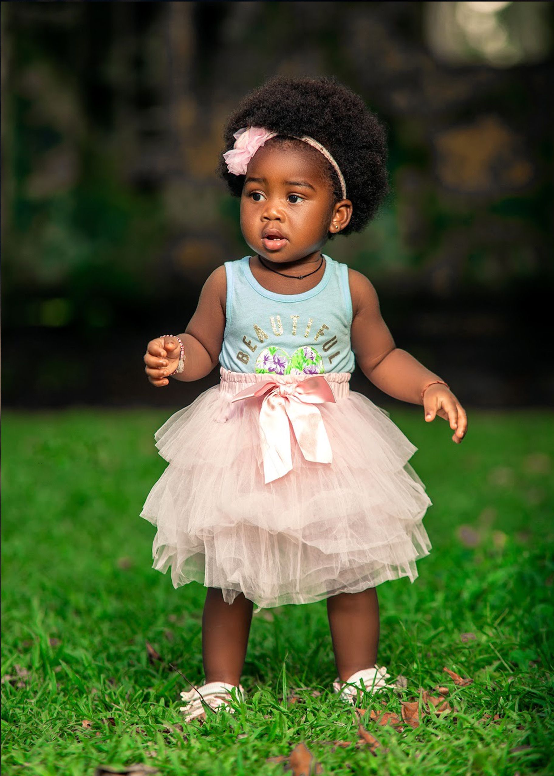 A Baby Girl with Afro Hair Wearing Headband · Free Stock Photo