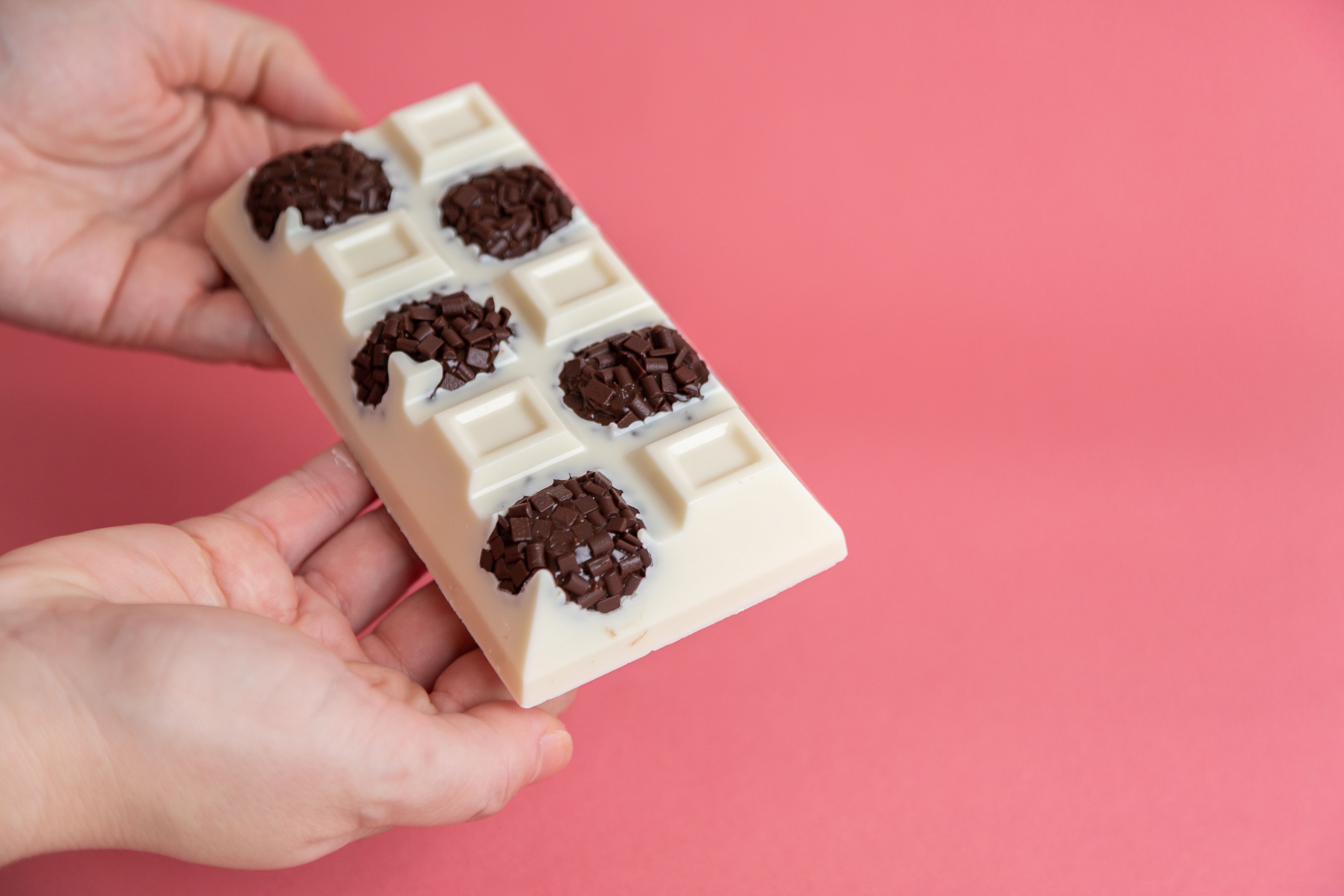 Brown Chocolate Bar on Multicolored Surface · Free Stock Photo