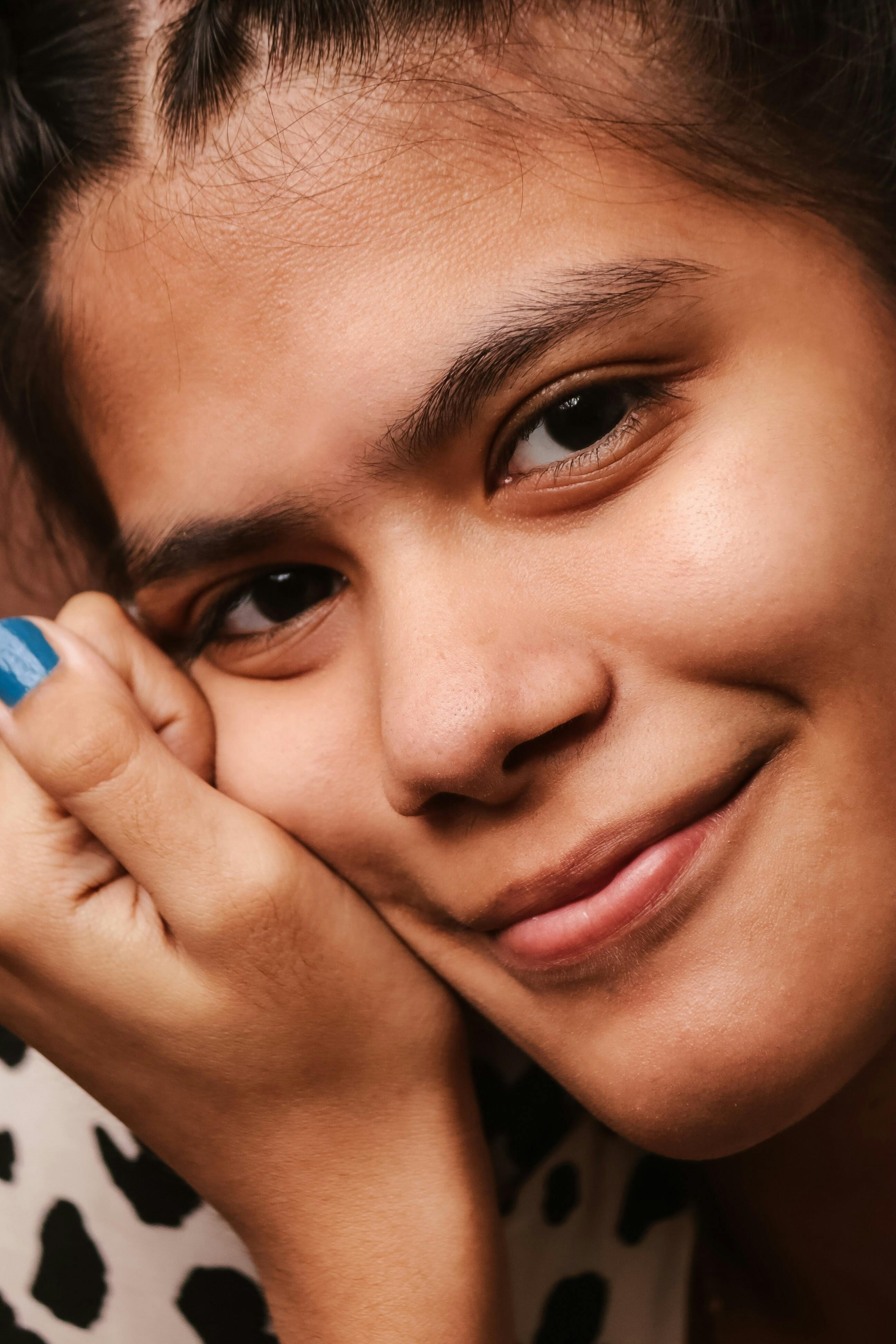 Close Up Shot of a Girl while Smiling · Free Stock Photo