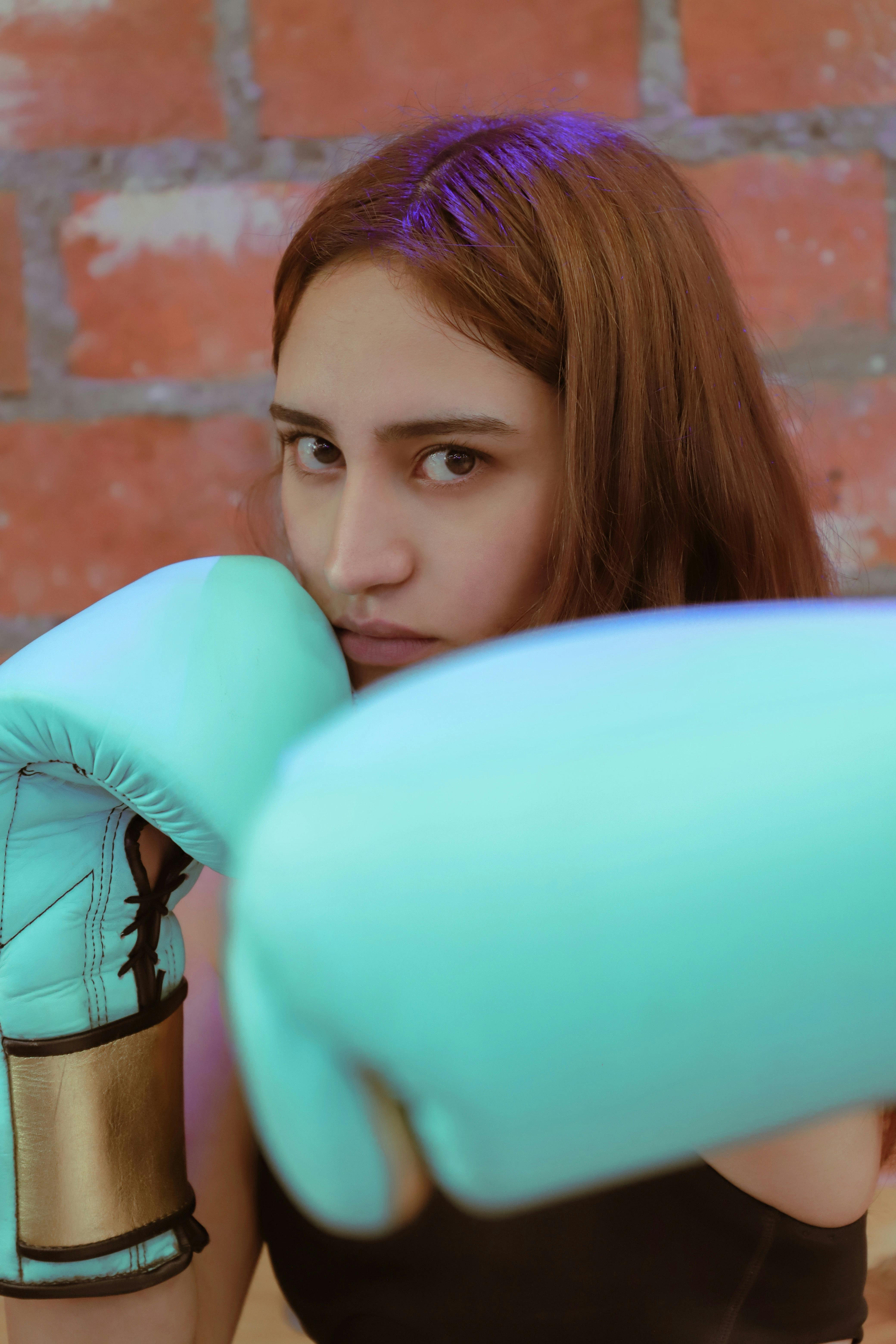 A Woman Wearing Boxing Gloves · Free Stock Photo