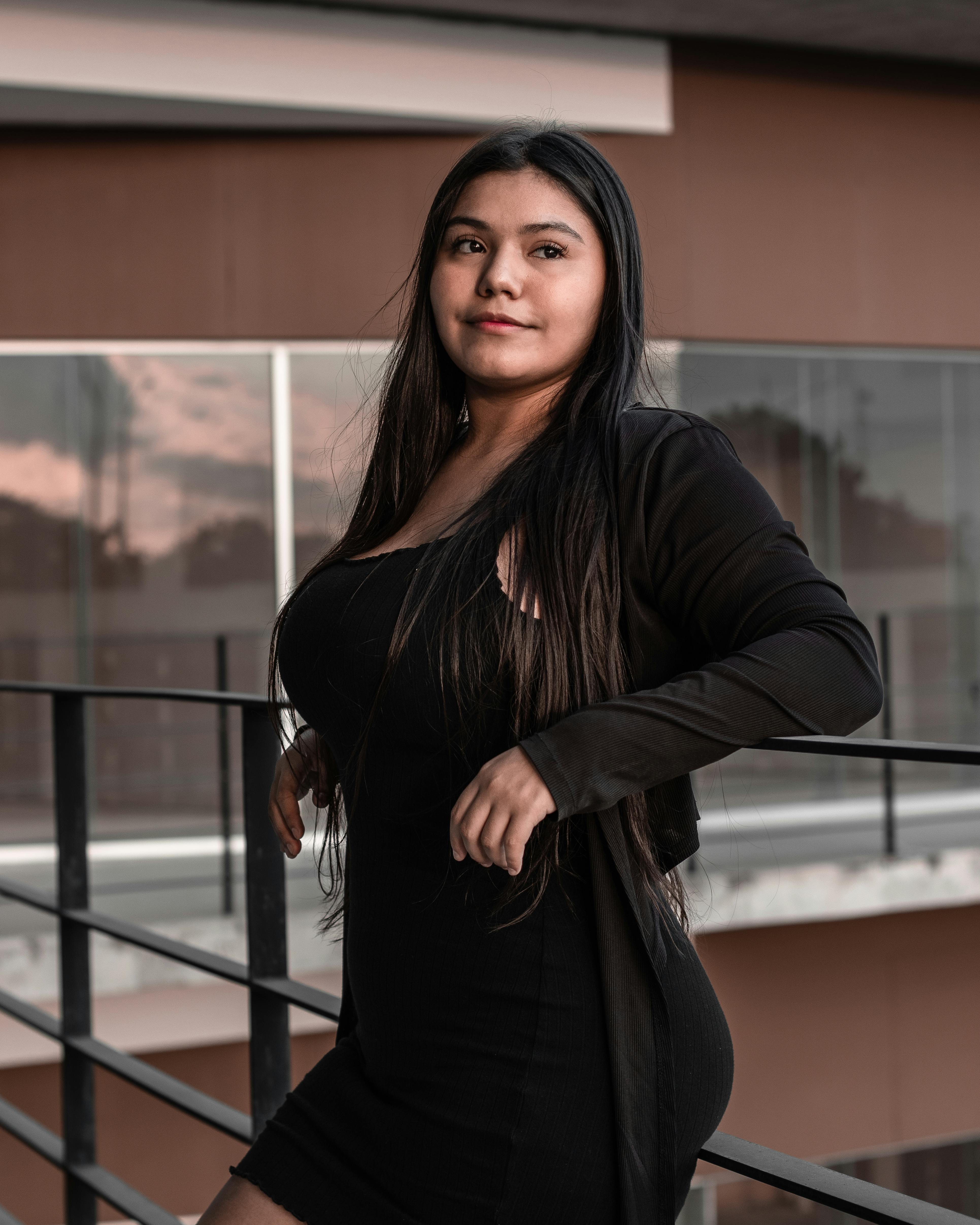 Woman Leaning Against Railing · Free Stock Photo