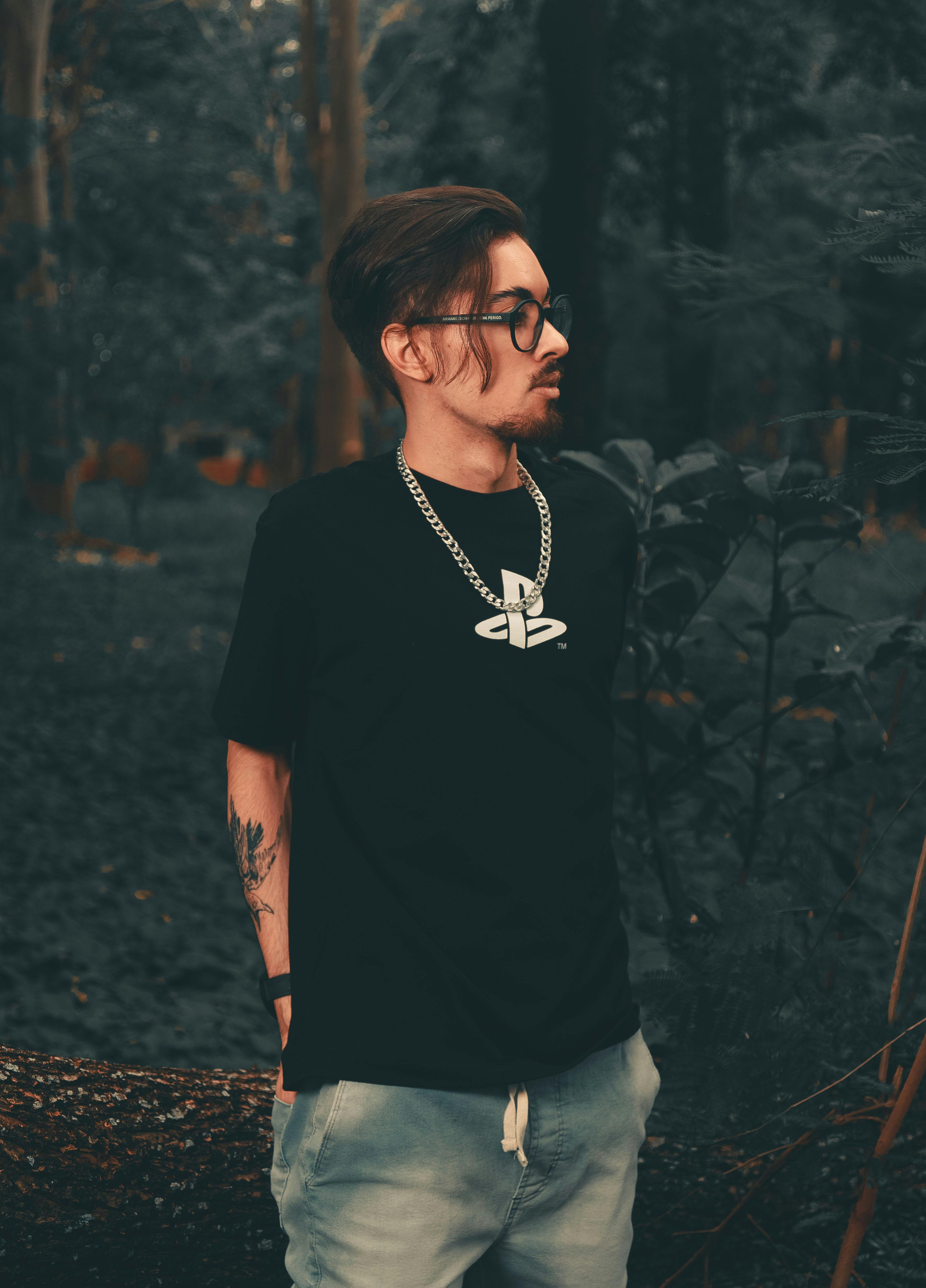 Photo of a Man with Chains on His Body · Free Stock Photo