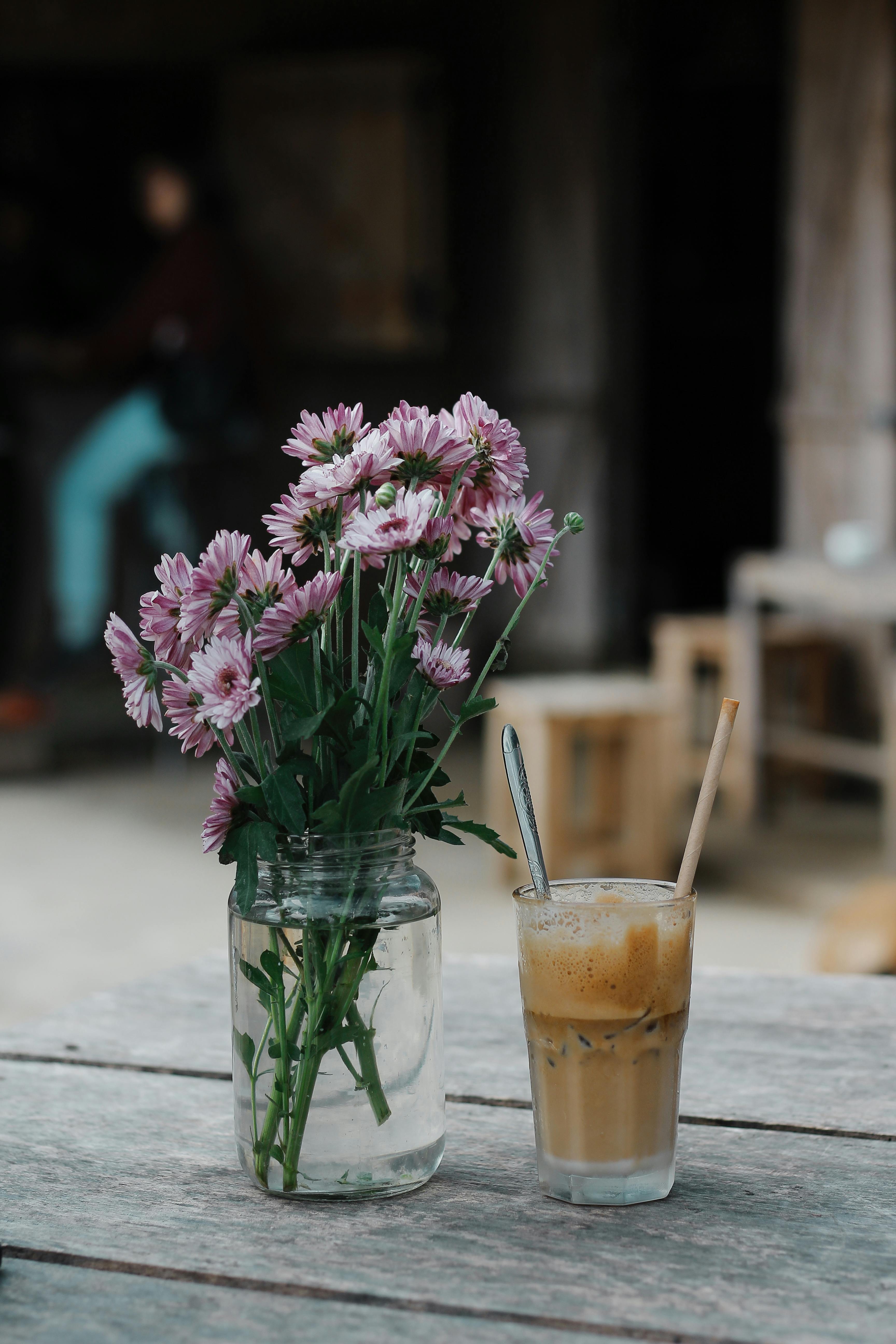 An Iced Coffee in a Glass, a Camera and a Bunch of Wildflowers · Free ...