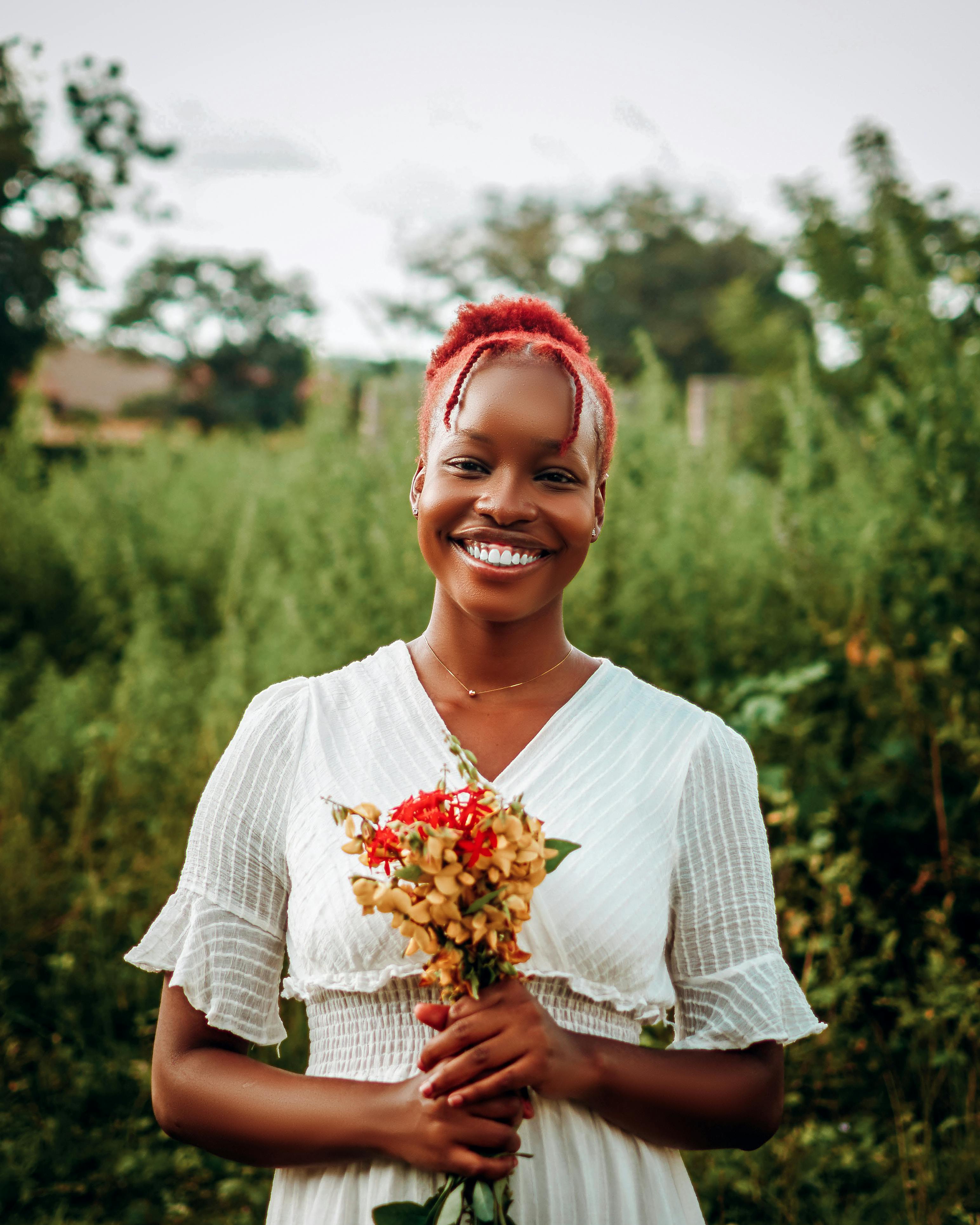Woman in Dress Posing among Plants · Free Stock Photo