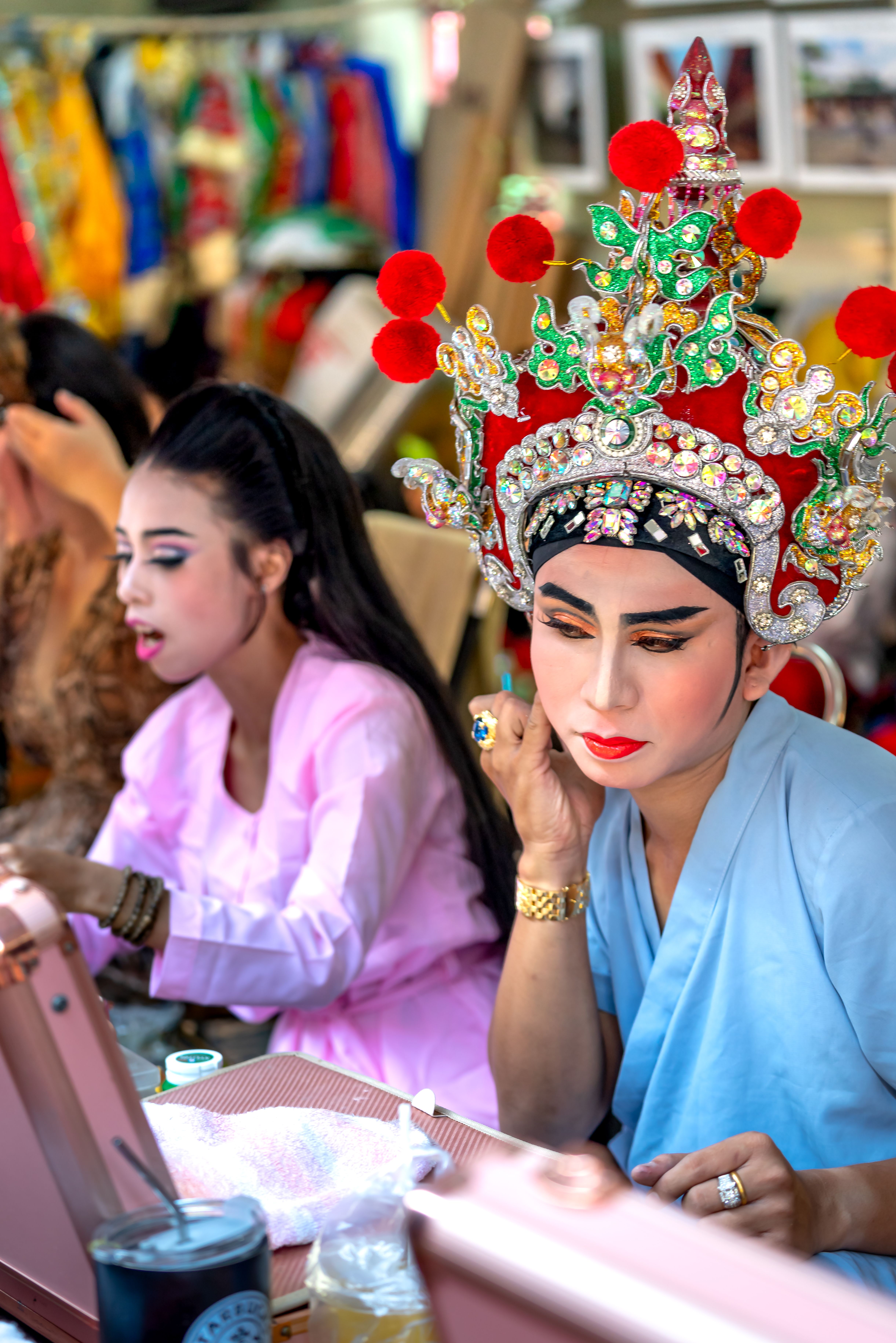 Woman in Elaborate Chinese Opera Headpiece Doing her Makeup · Free ...