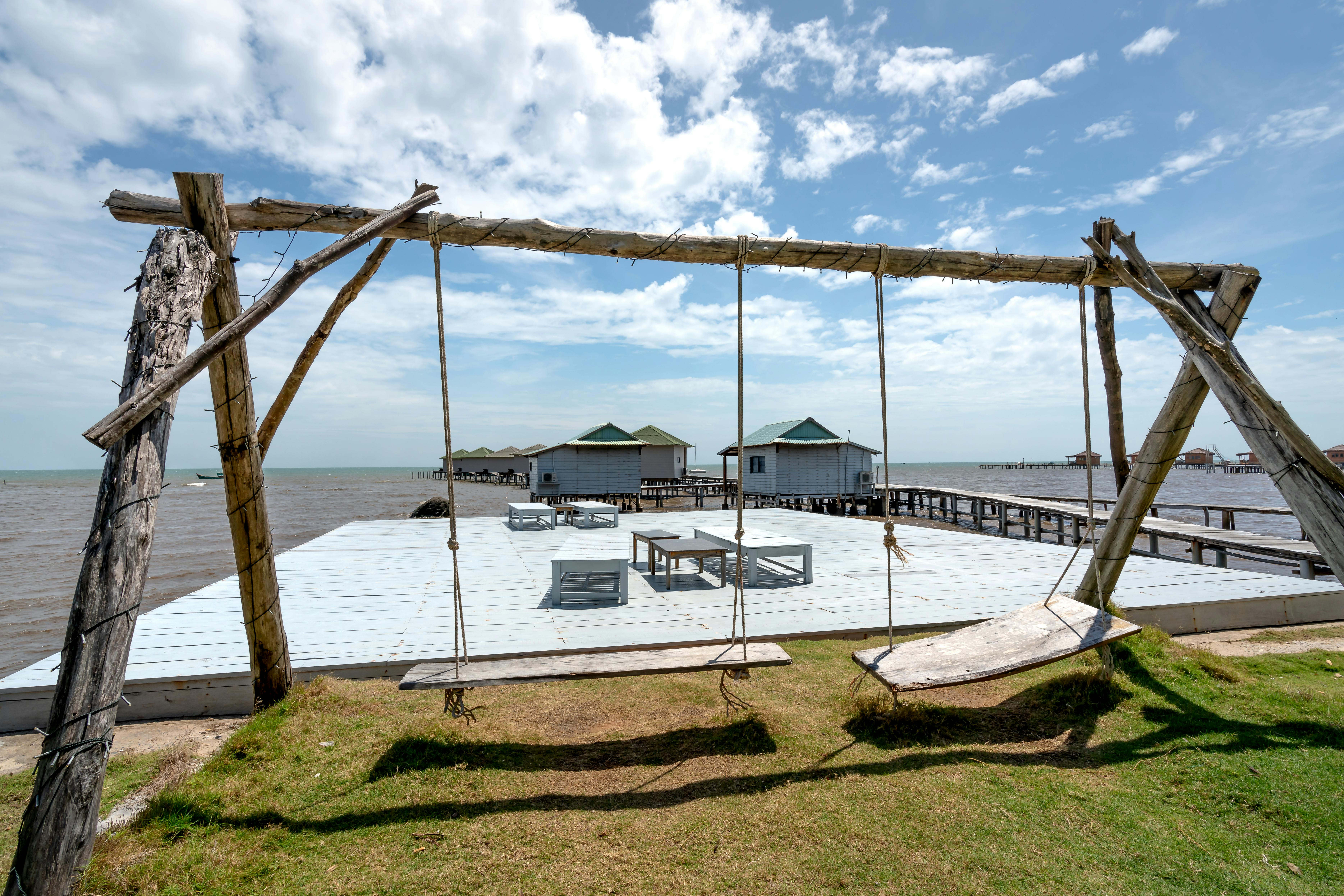 Wooden Swings by the Seaside · Free Stock Photo