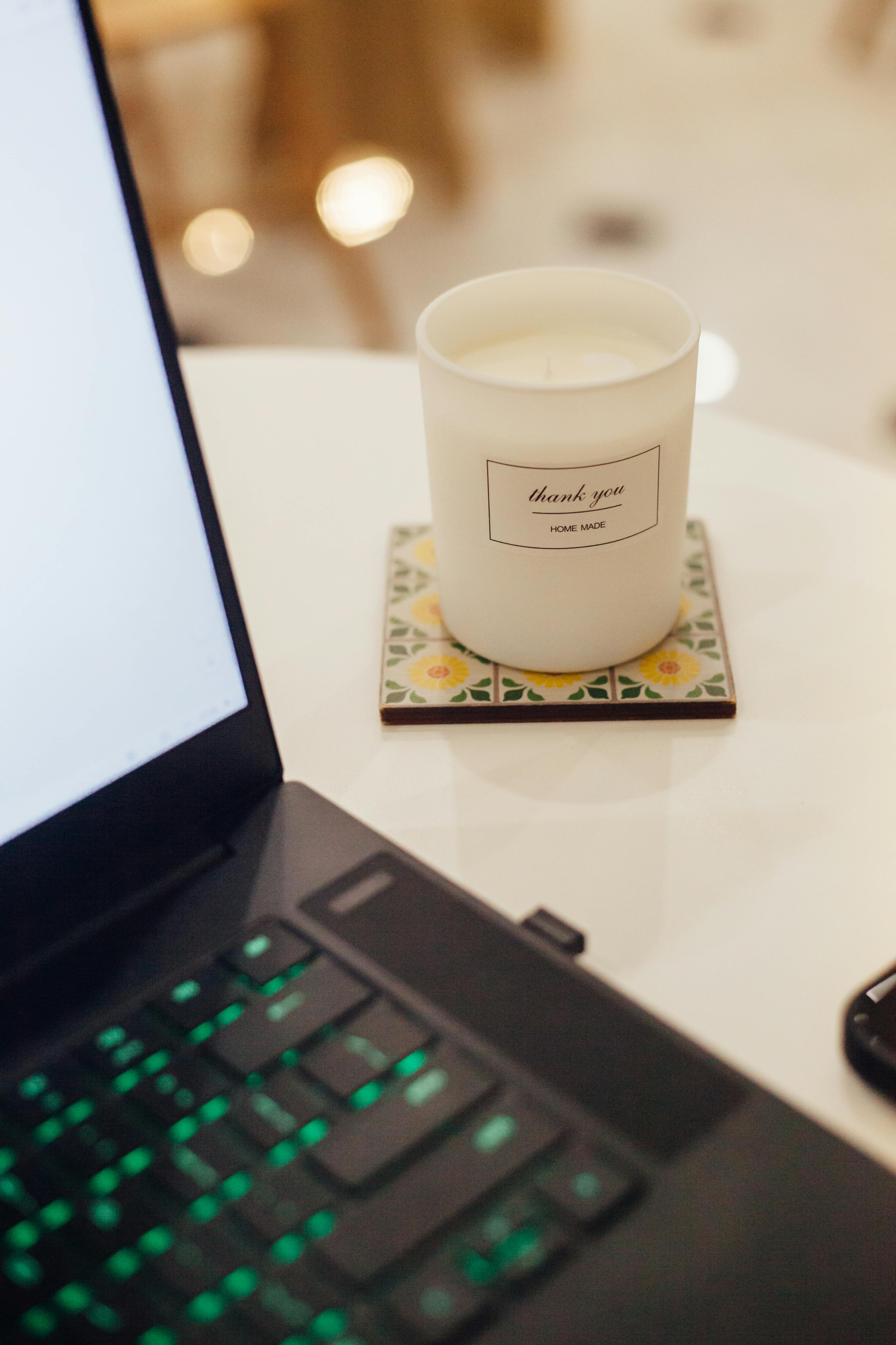 Laptop and a Cup on a Desk · Free Stock Photo