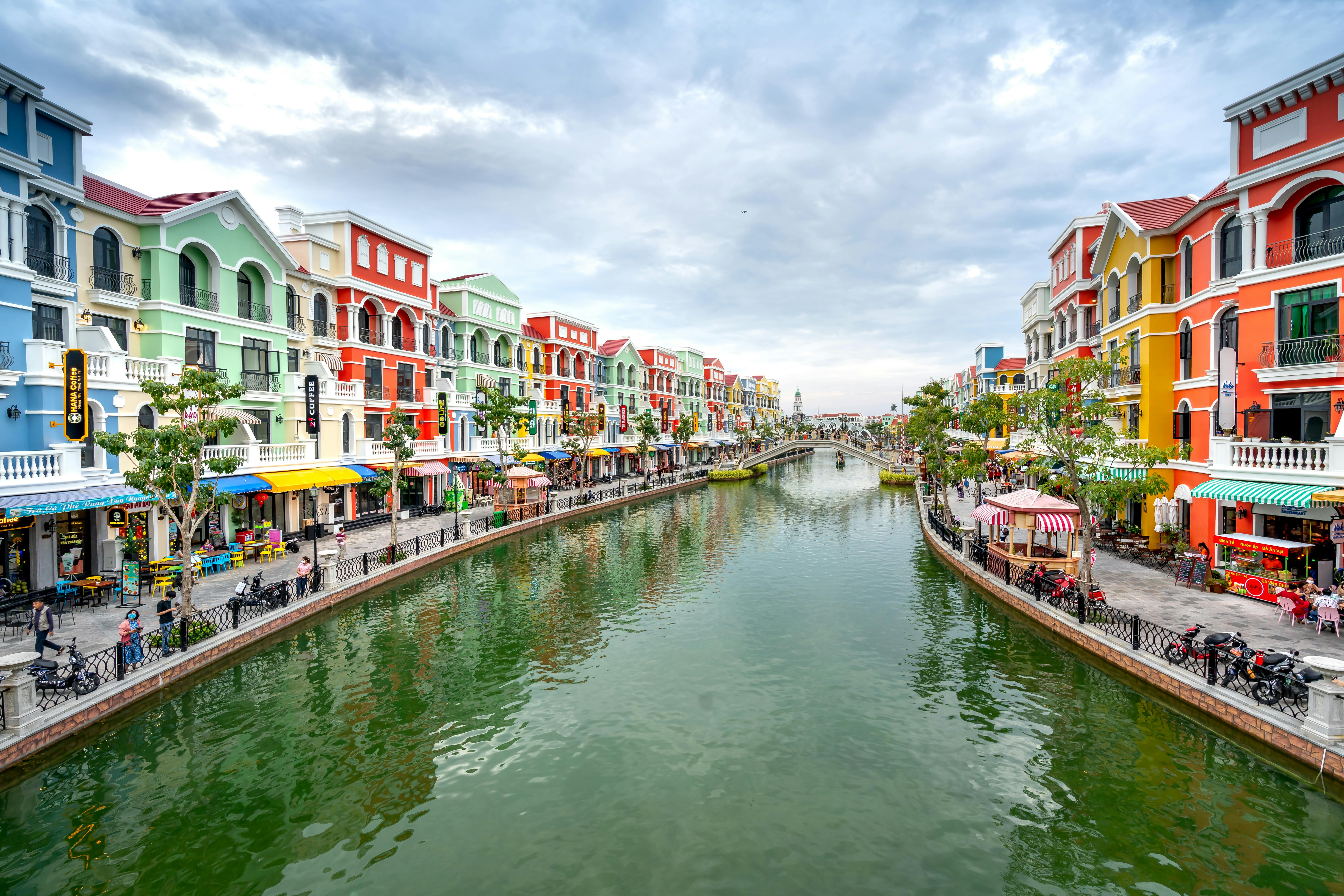 An Aerial Photography of a River Between Colorful Houses · Free Stock Photo