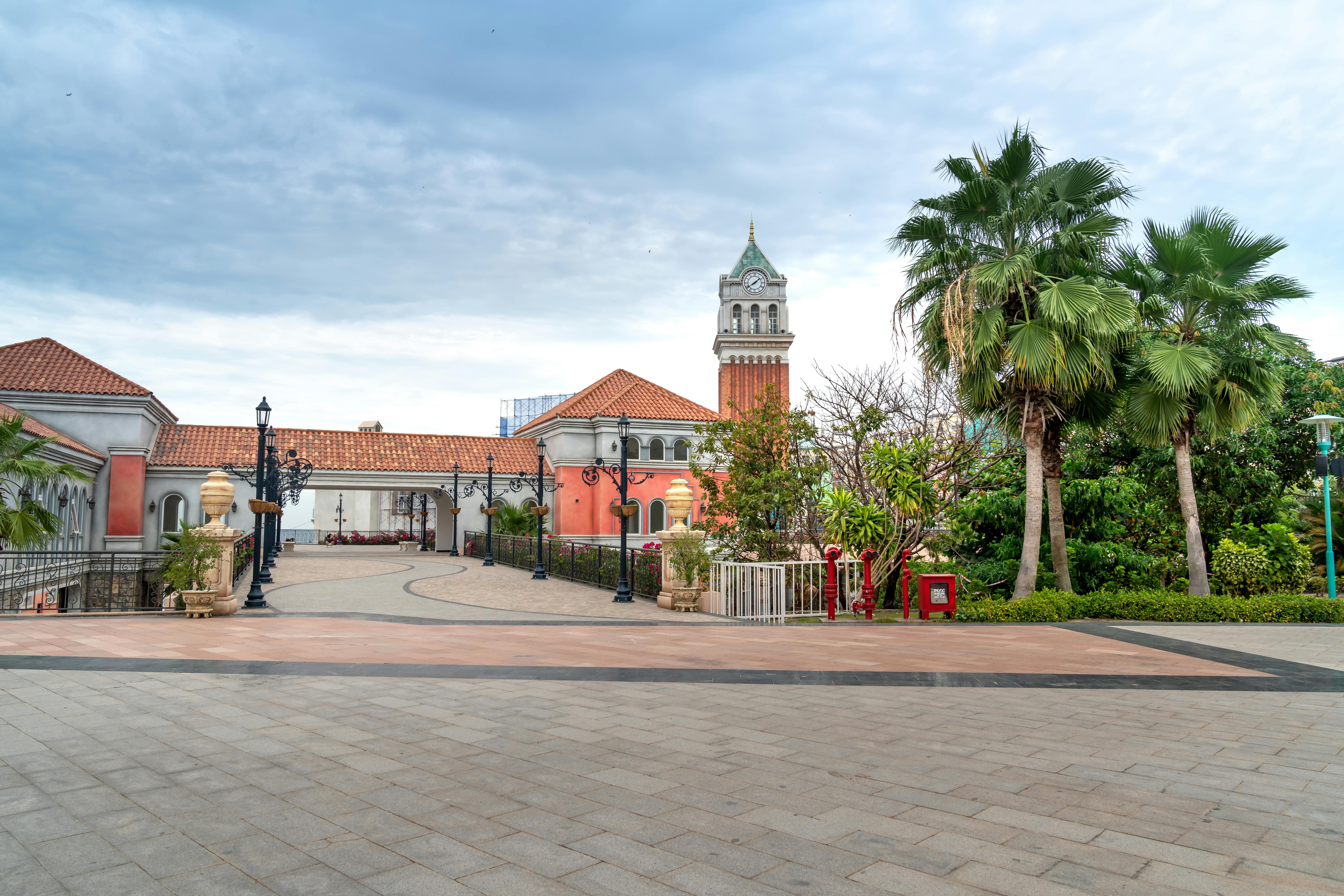 Town Square with Clock Tower and Palm Trees · Free Stock Photo