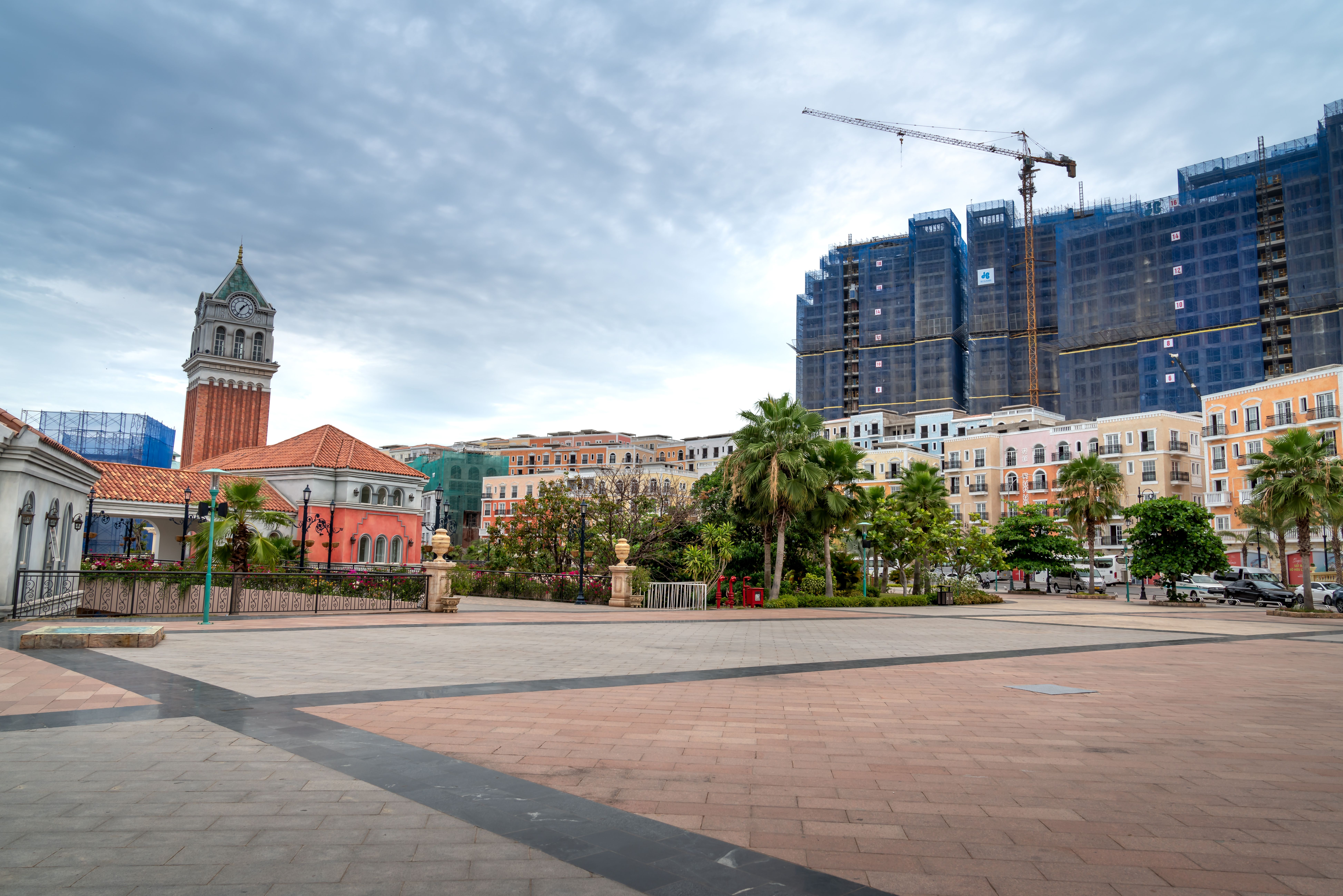 City Square with a Construction Site and Clock Tower · Free Stock Photo