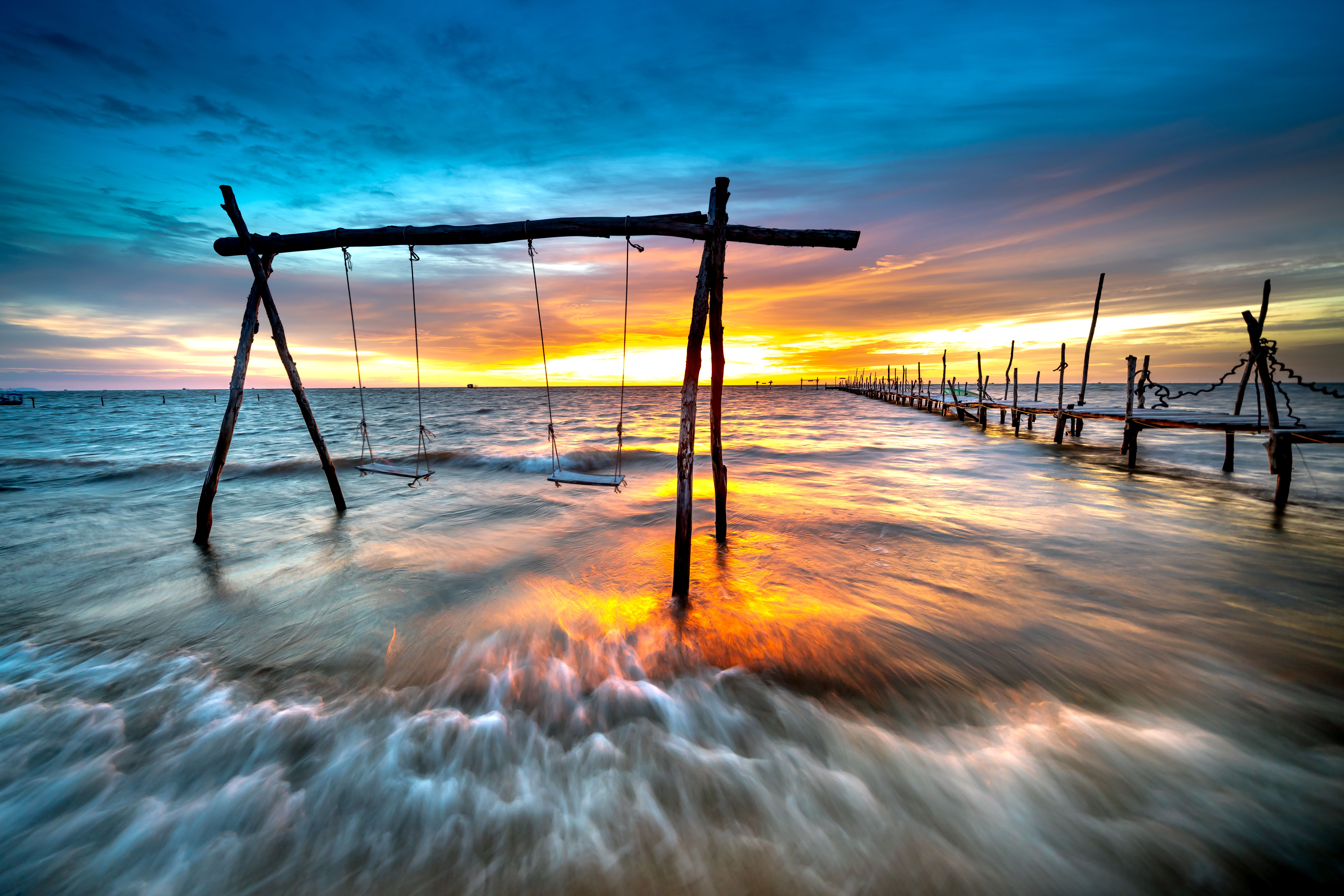 Swing and Pier on Beach at Sunset · Free Stock Photo