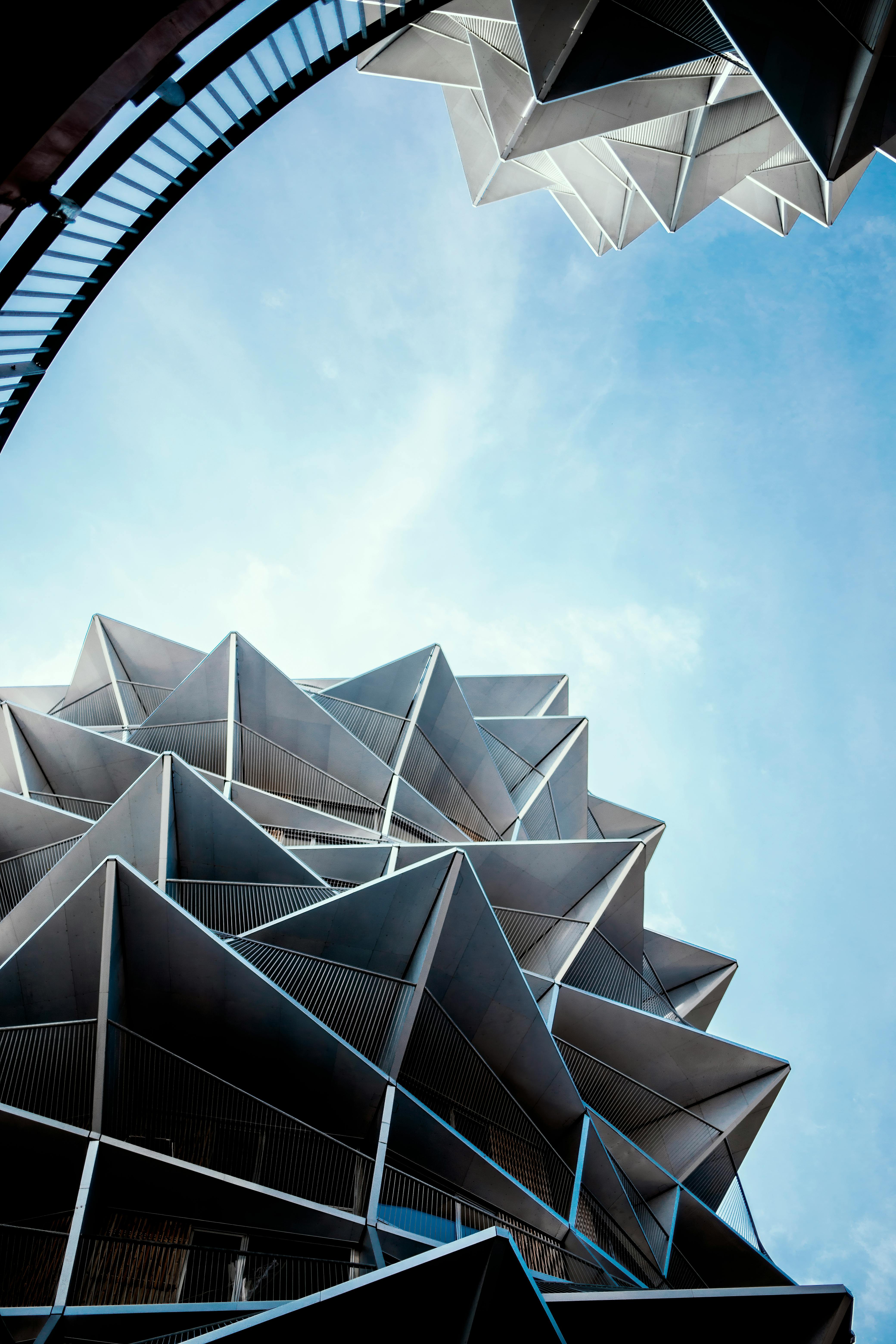 Modern Geometric Building on Sky Background · Free Stock Photo