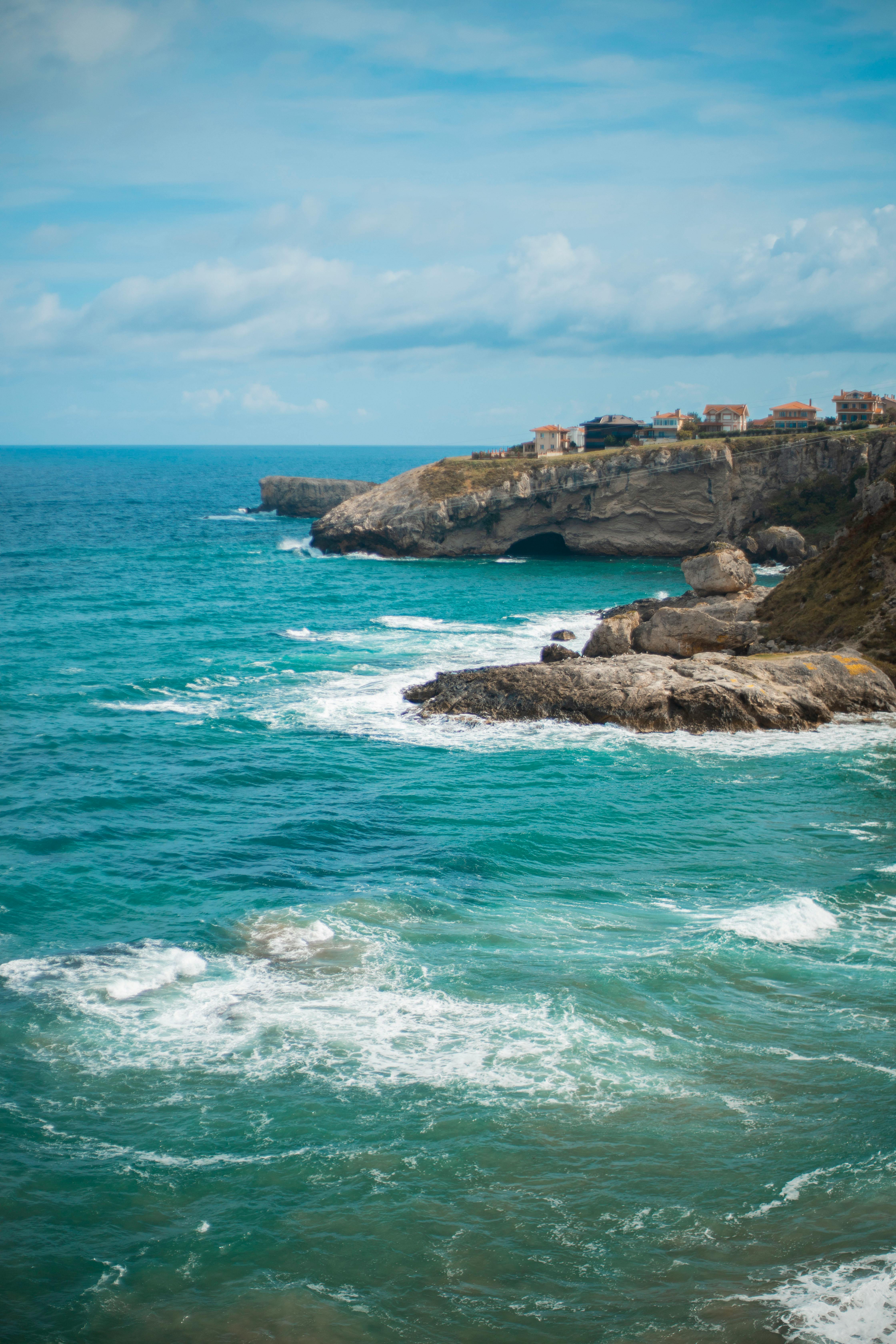 Brown Rock Formation on Sea · Free Stock Photo