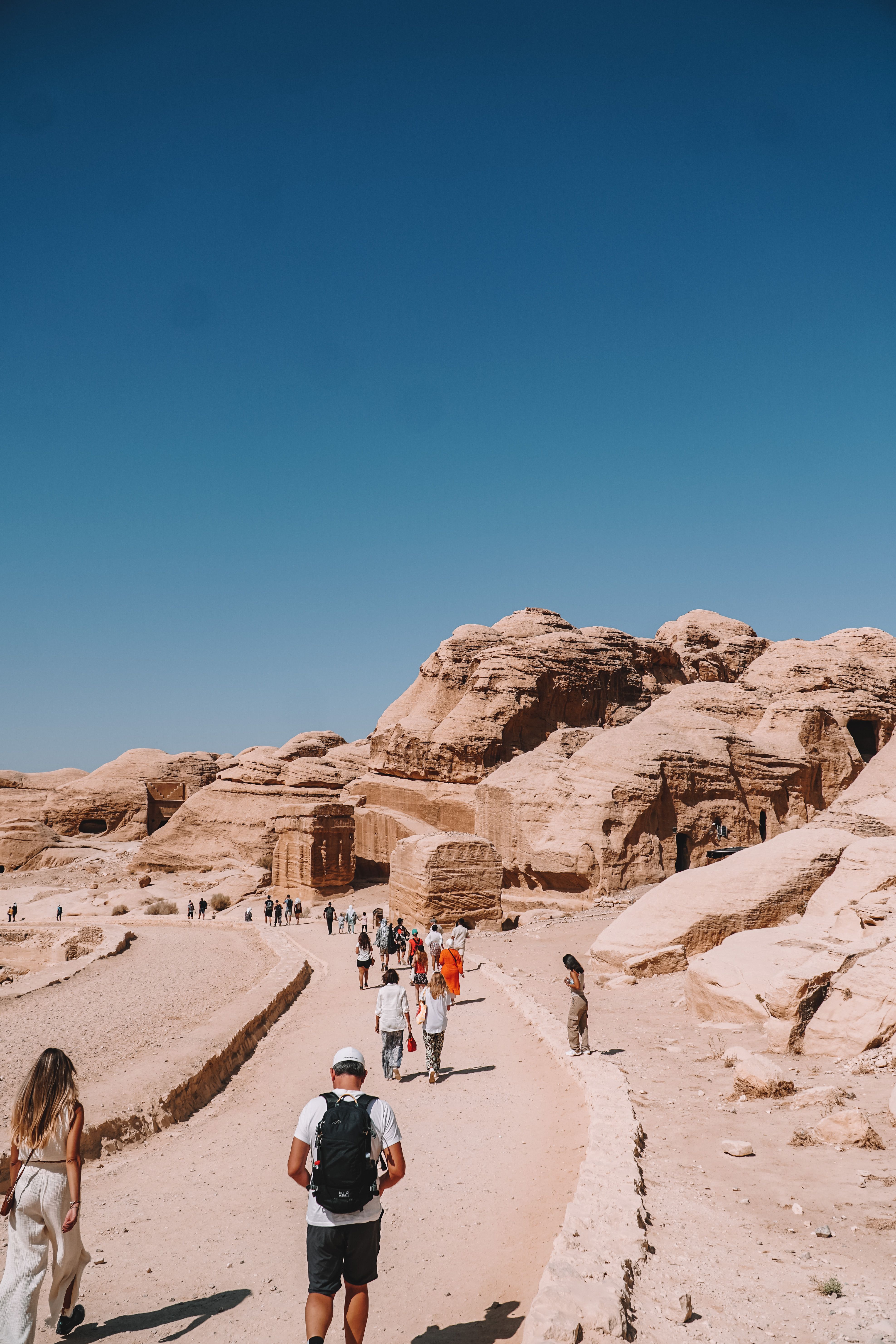 Sandy desert with ancient sandstone pyramid · Free Stock Photo