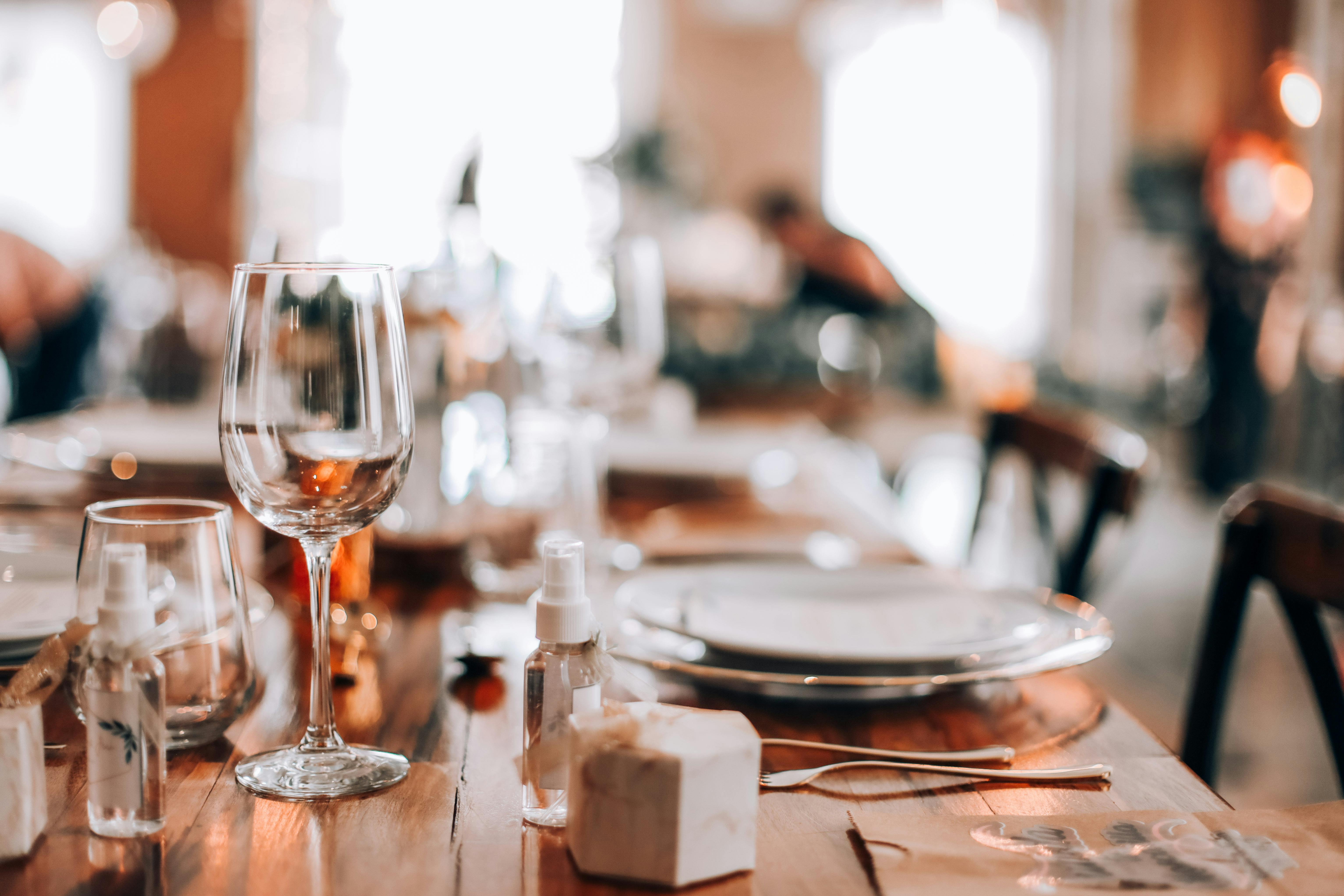Wine Glass on Restaurant Table · Free Stock Photo