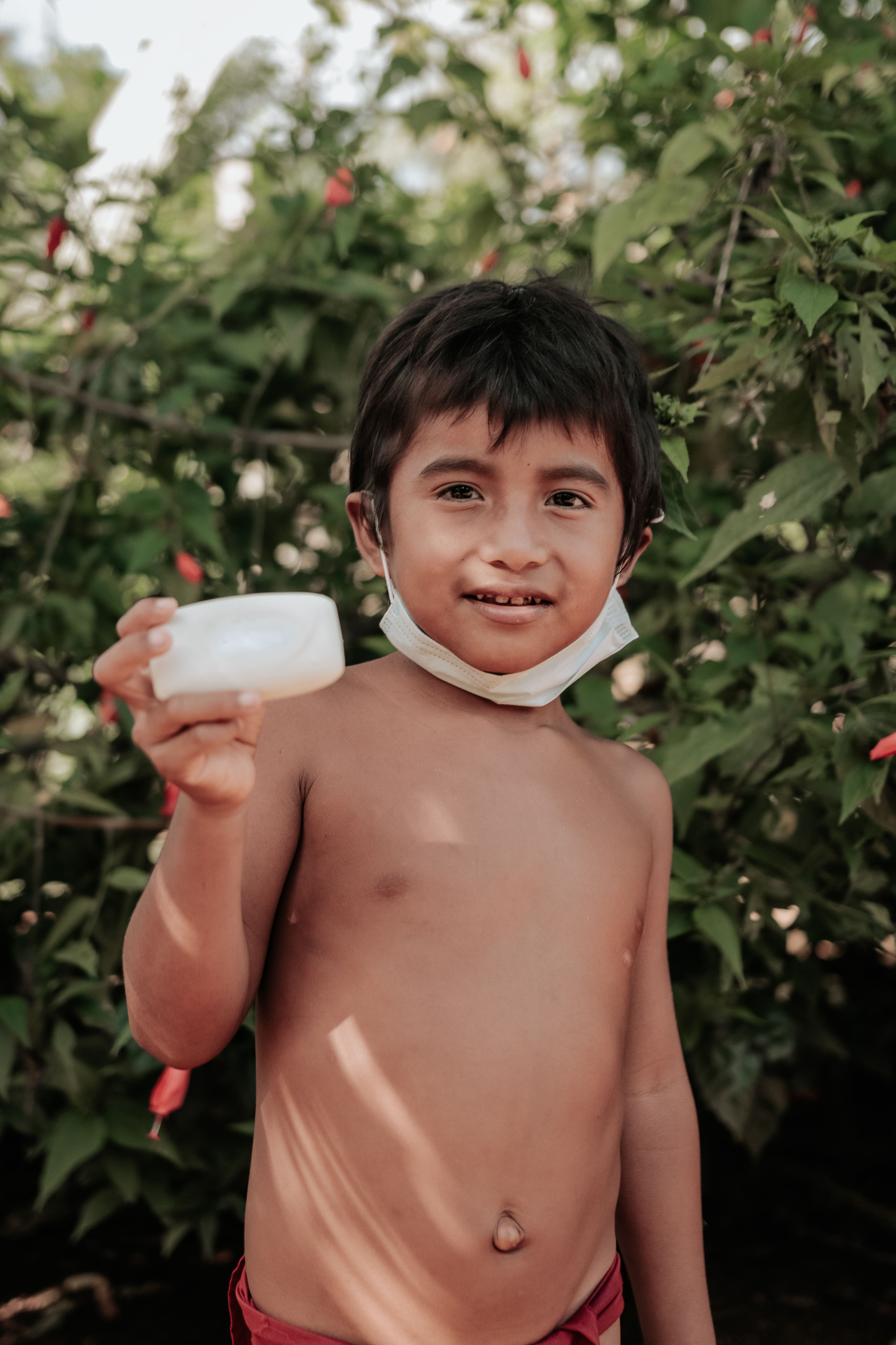 Photo of a Boy Holding a White Soap Bar · Free Stock Photo