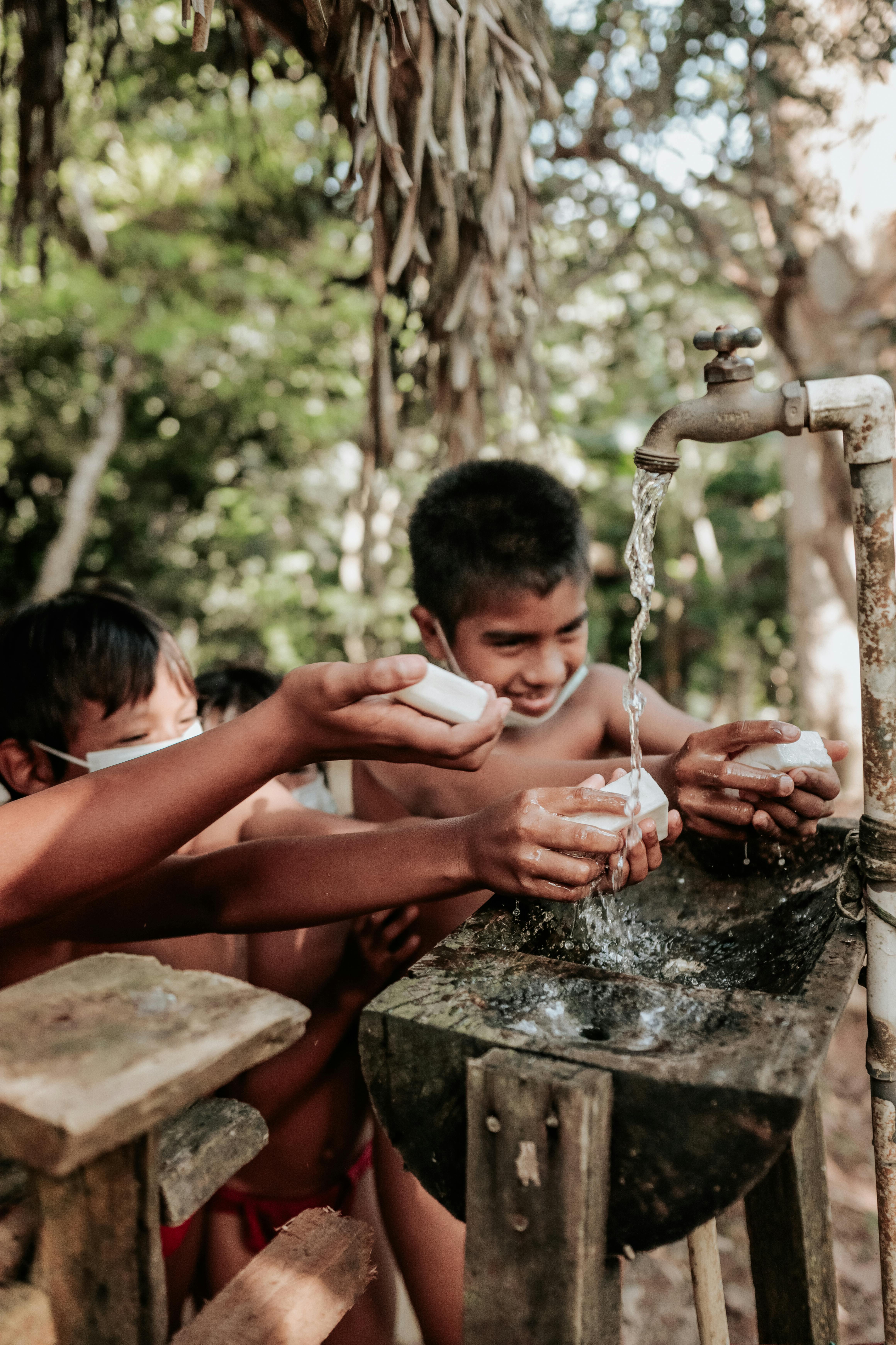 Boys Washing their Hands · Free Stock Photo