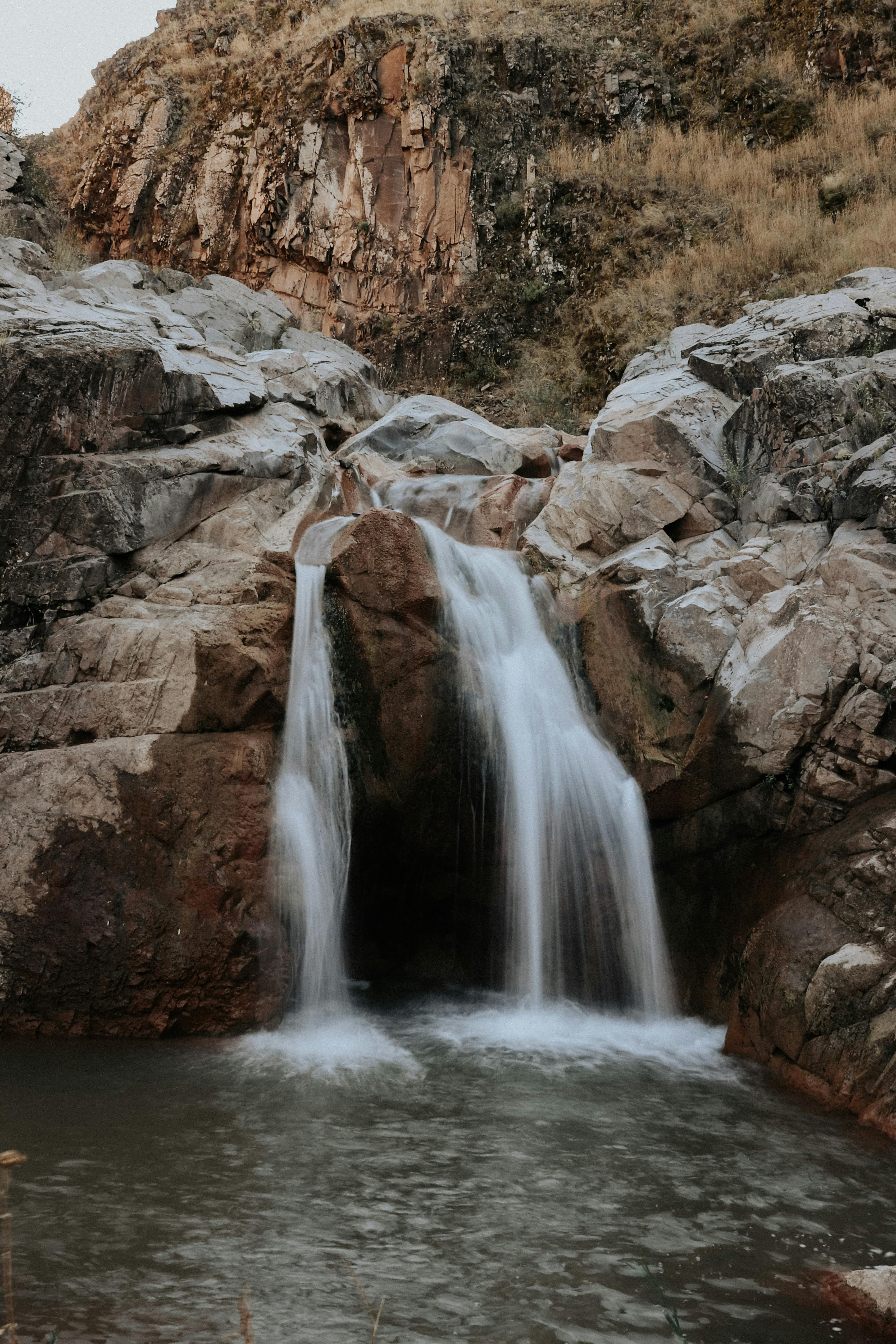 Water Falling From Big Rocks Down to the Stream · Free Stock Photo