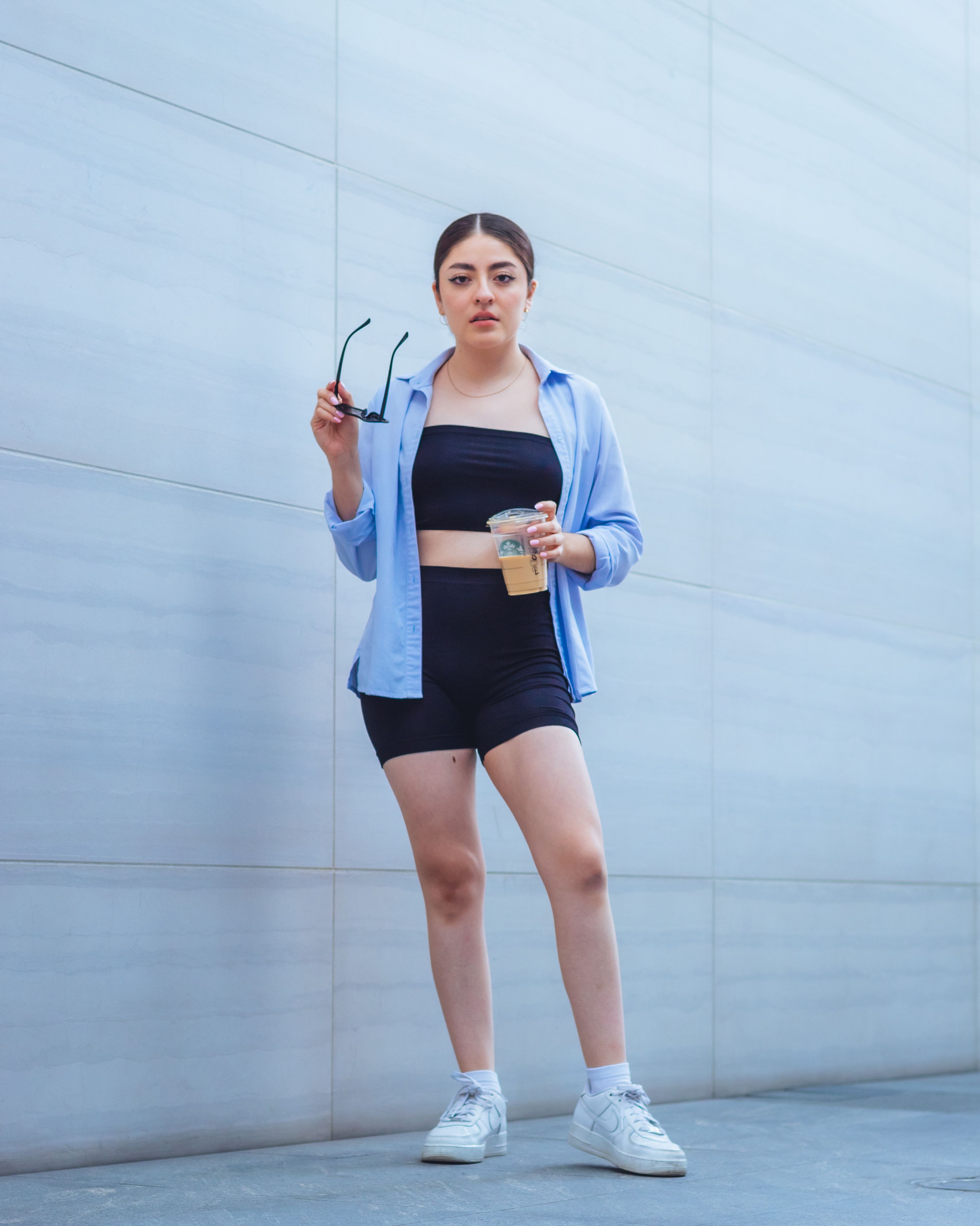 Woman in Summer Clothes Holding Shades in Hand · Free Stock Photo