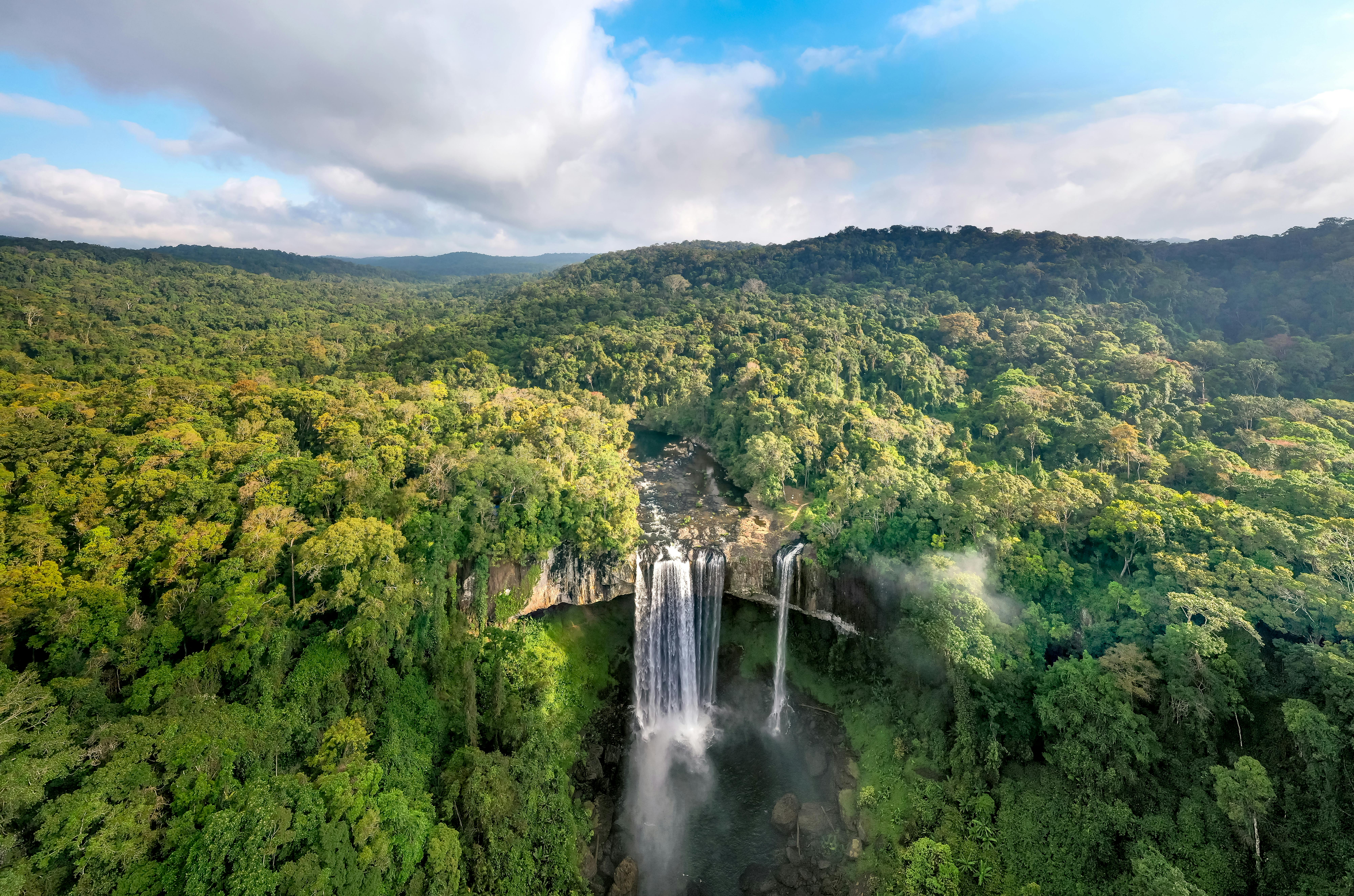 Waterfalls in the Middle of Green Trees Under Blue Sky and White Clouds ...