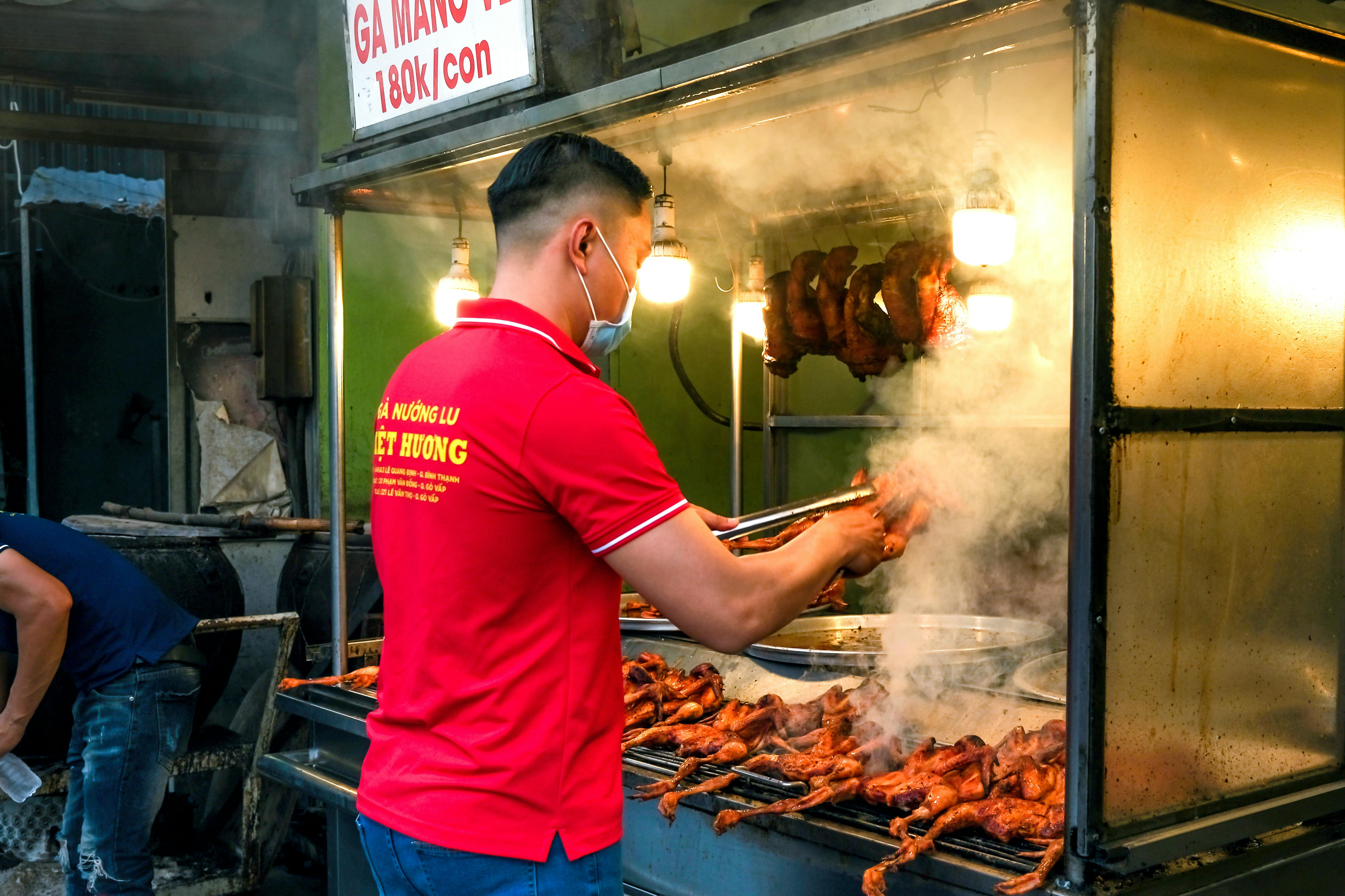 Man Cooking Chicken on Grill on Street Stall · Free Stock Photo