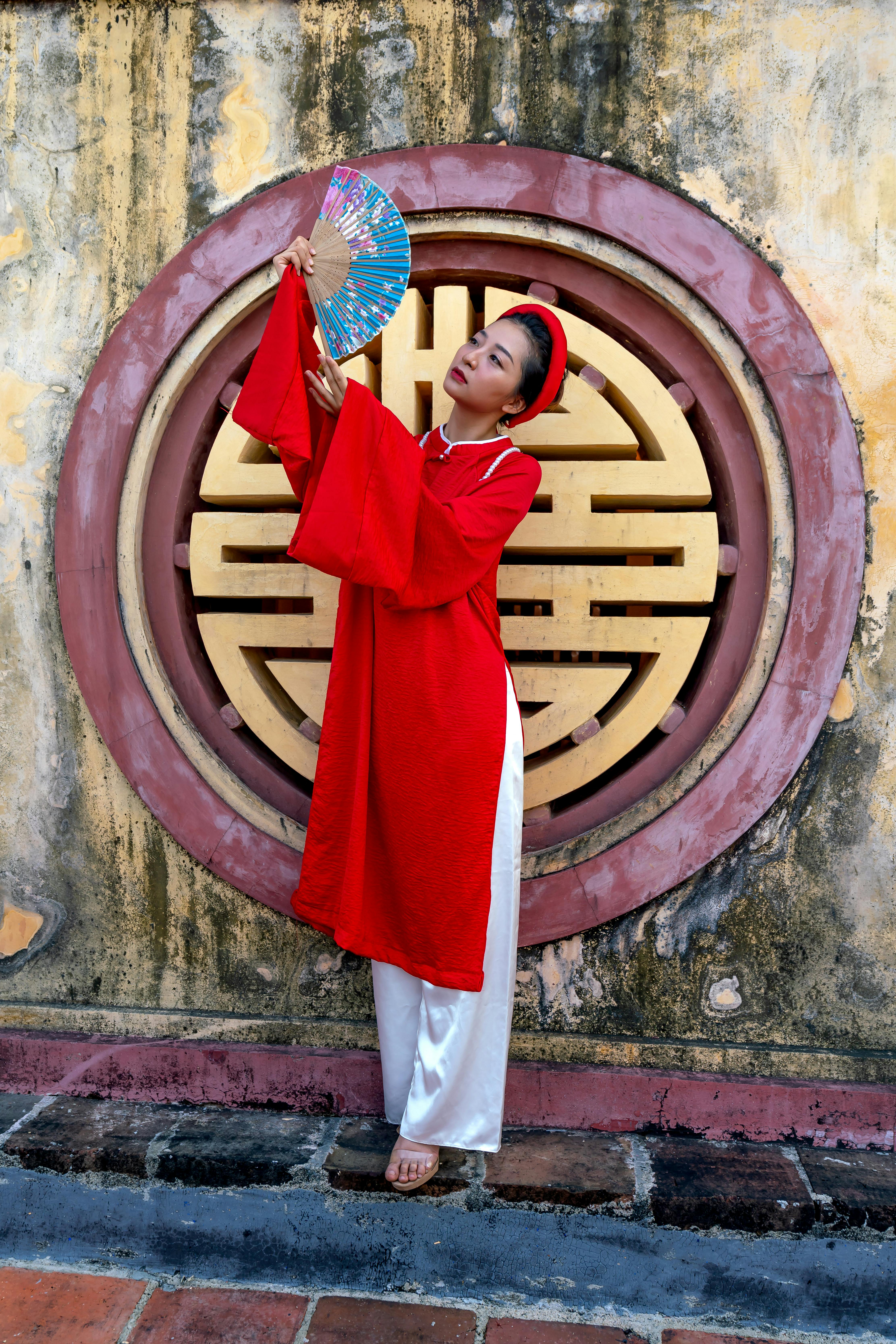 Woman in Red Dress Raising Her Hand Fan · Free Stock Photo