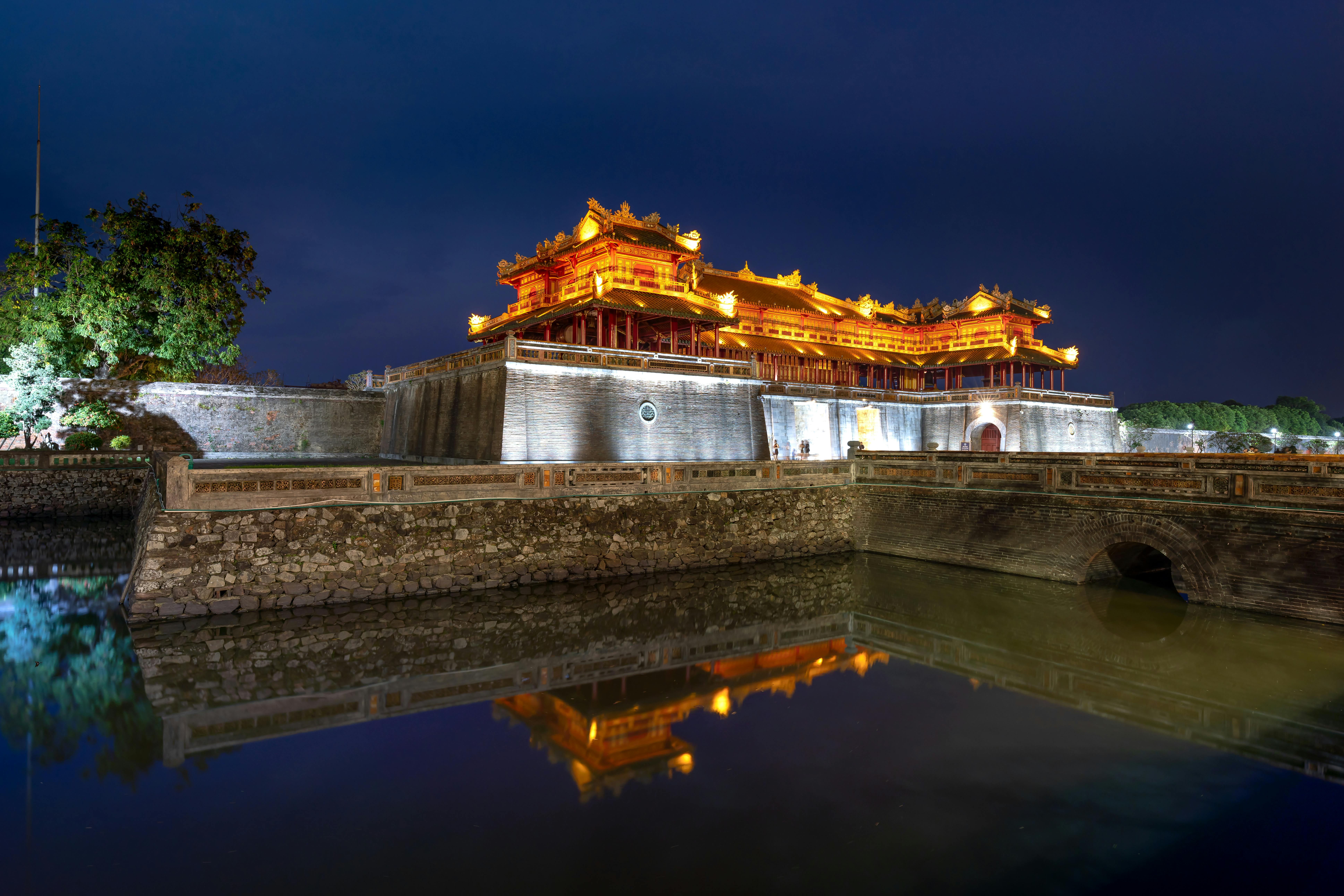 Illuminated Traditional Castle near Water · Free Stock Photo