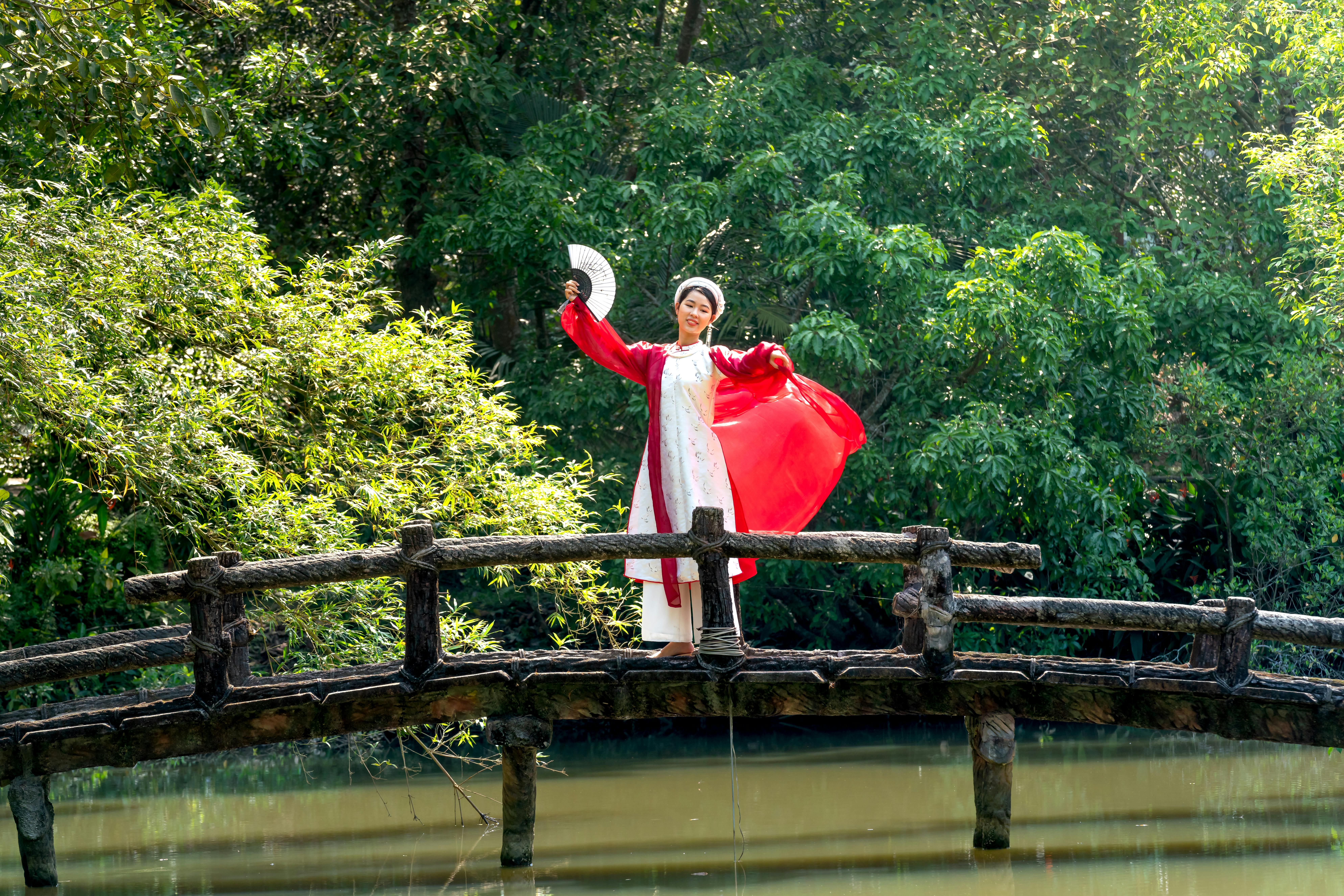 Woman Standing on a Bridge · Free Stock Photo