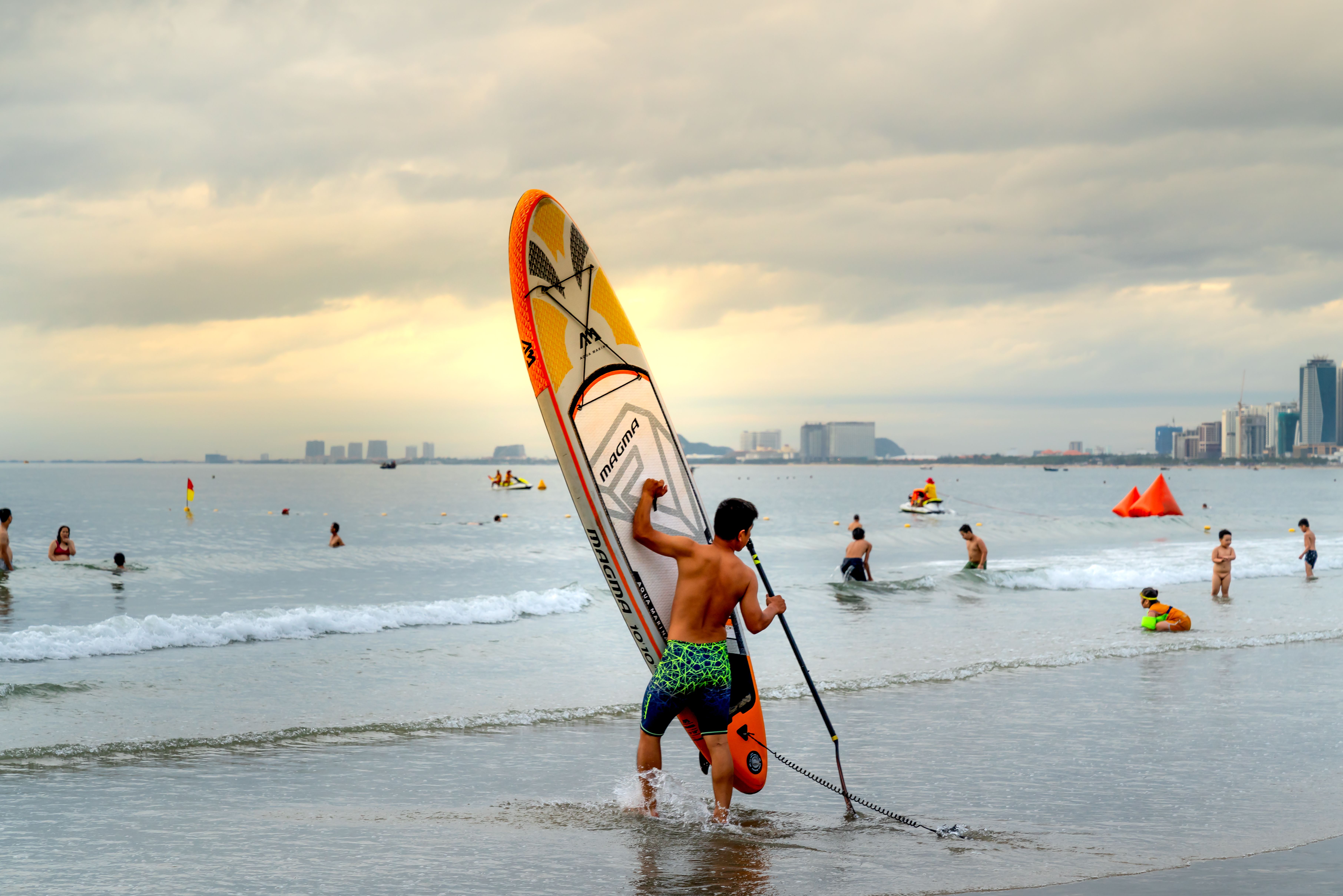 Man Carrying a Surfboard · Free Stock Photo