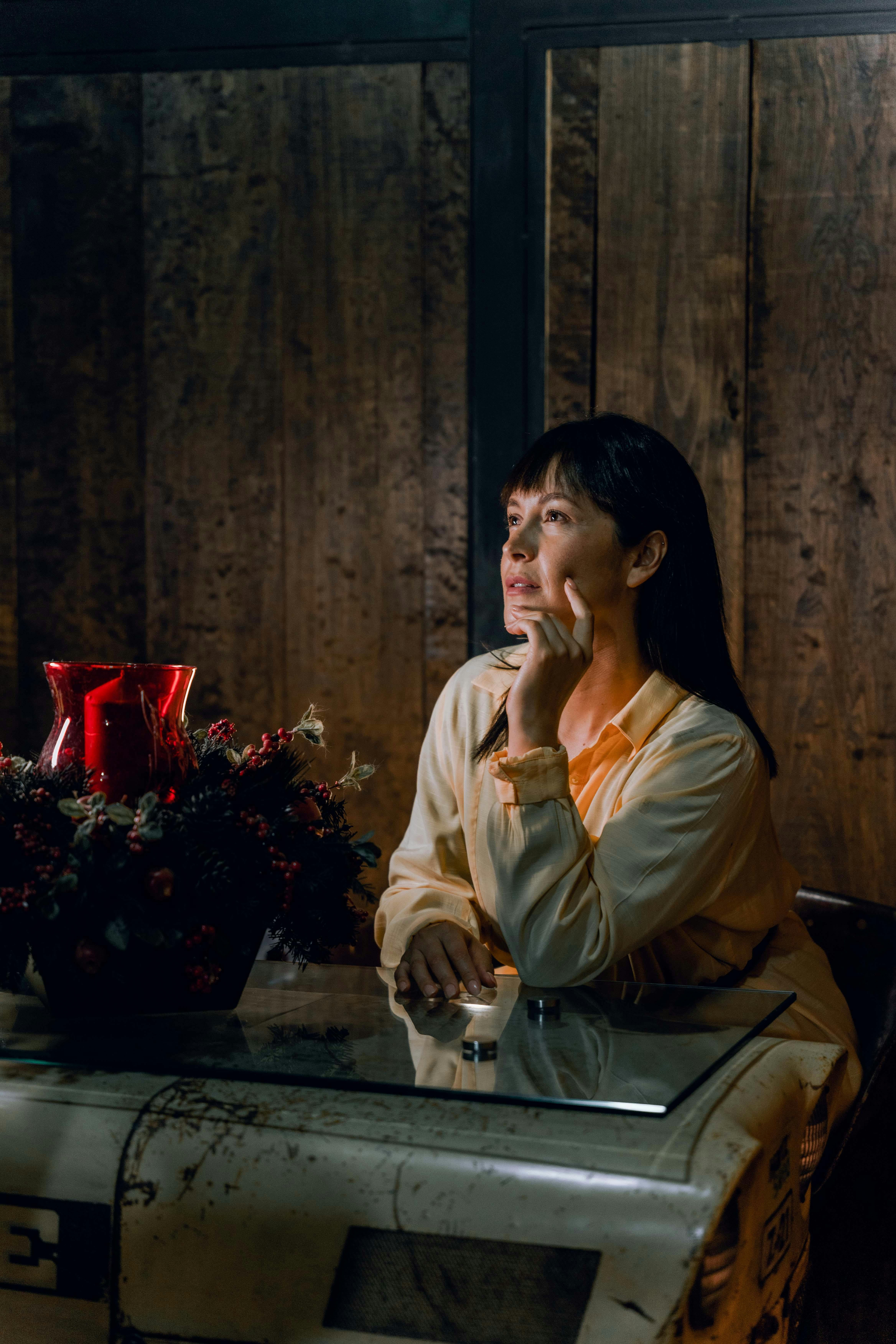 Woman Thinking with Hand on Cheek · Free Stock Photo