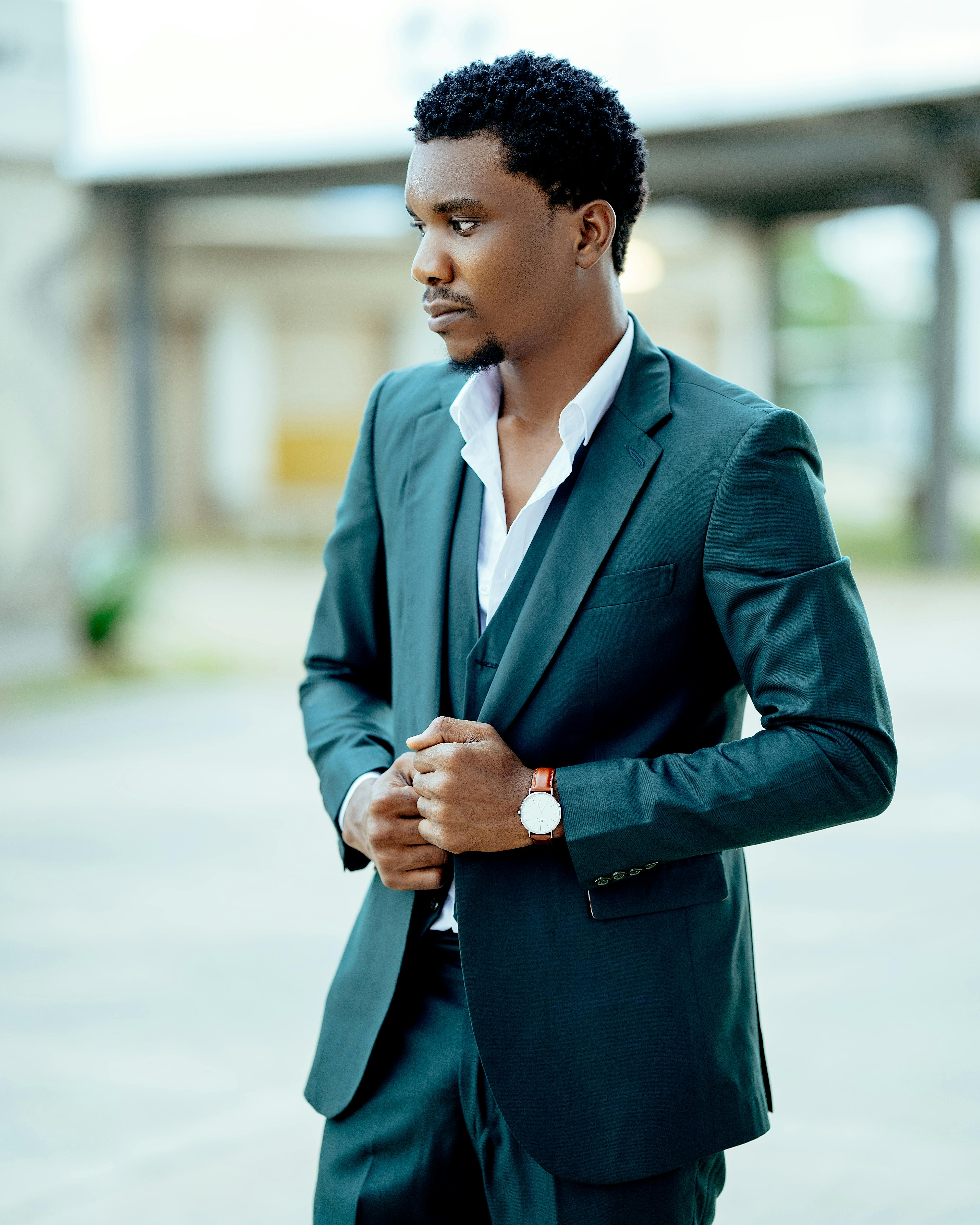 A Man Wearing a Suit Jacket · Free Stock Photo