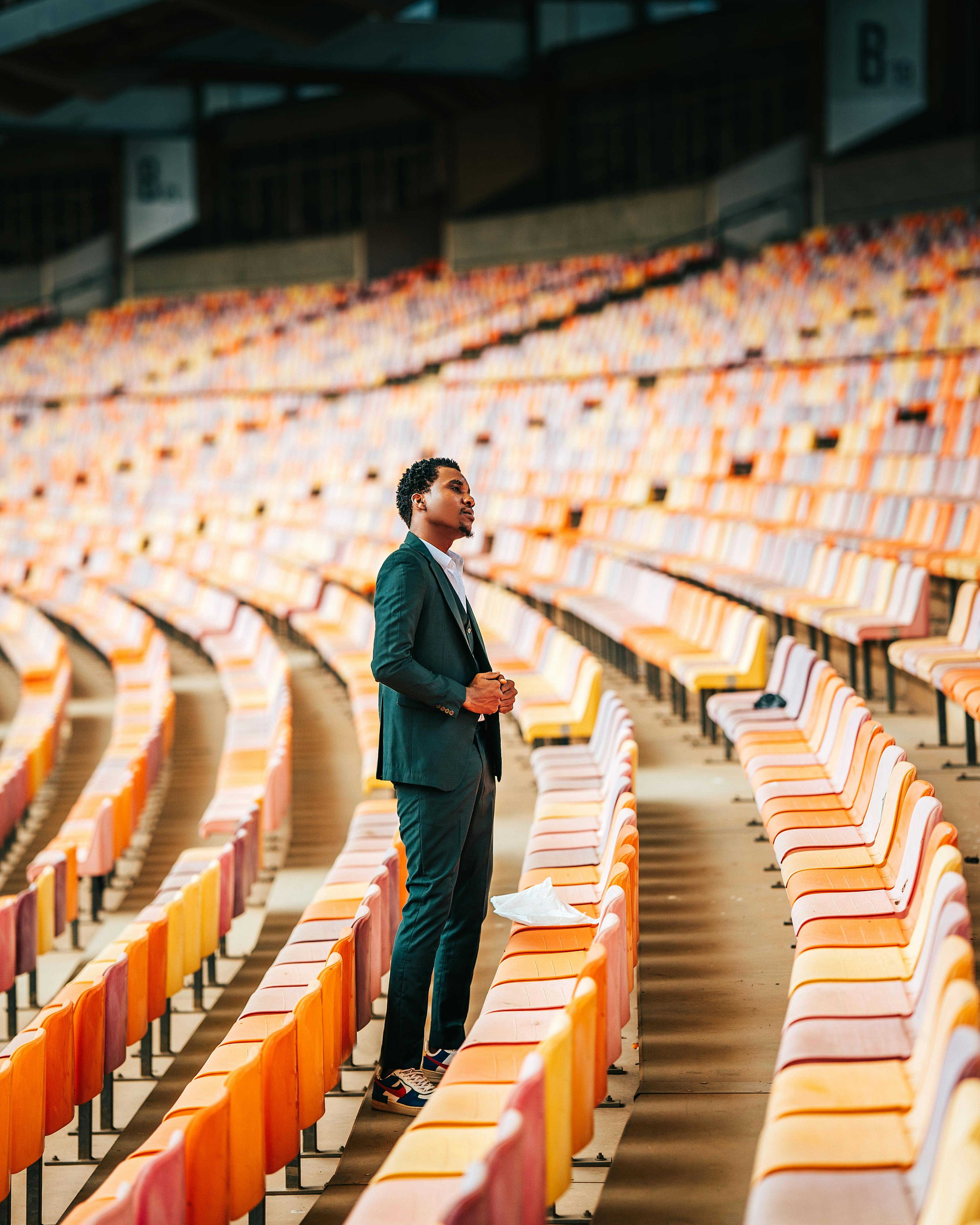 Man in Suit at Stadium · Free Stock Photo