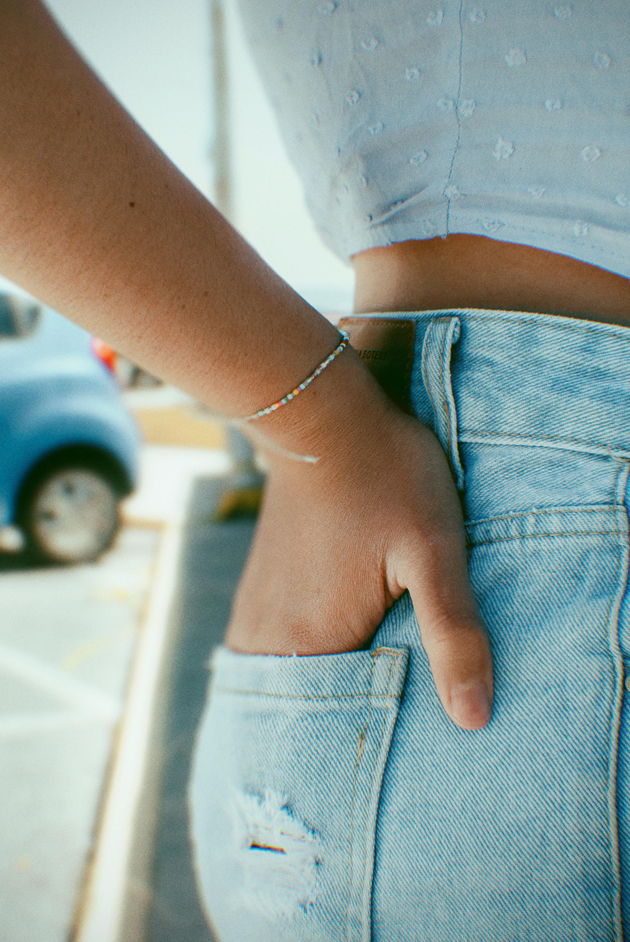 Person Standing with Hand in Back Pocket of Denim Jeans · Free Stock Photo