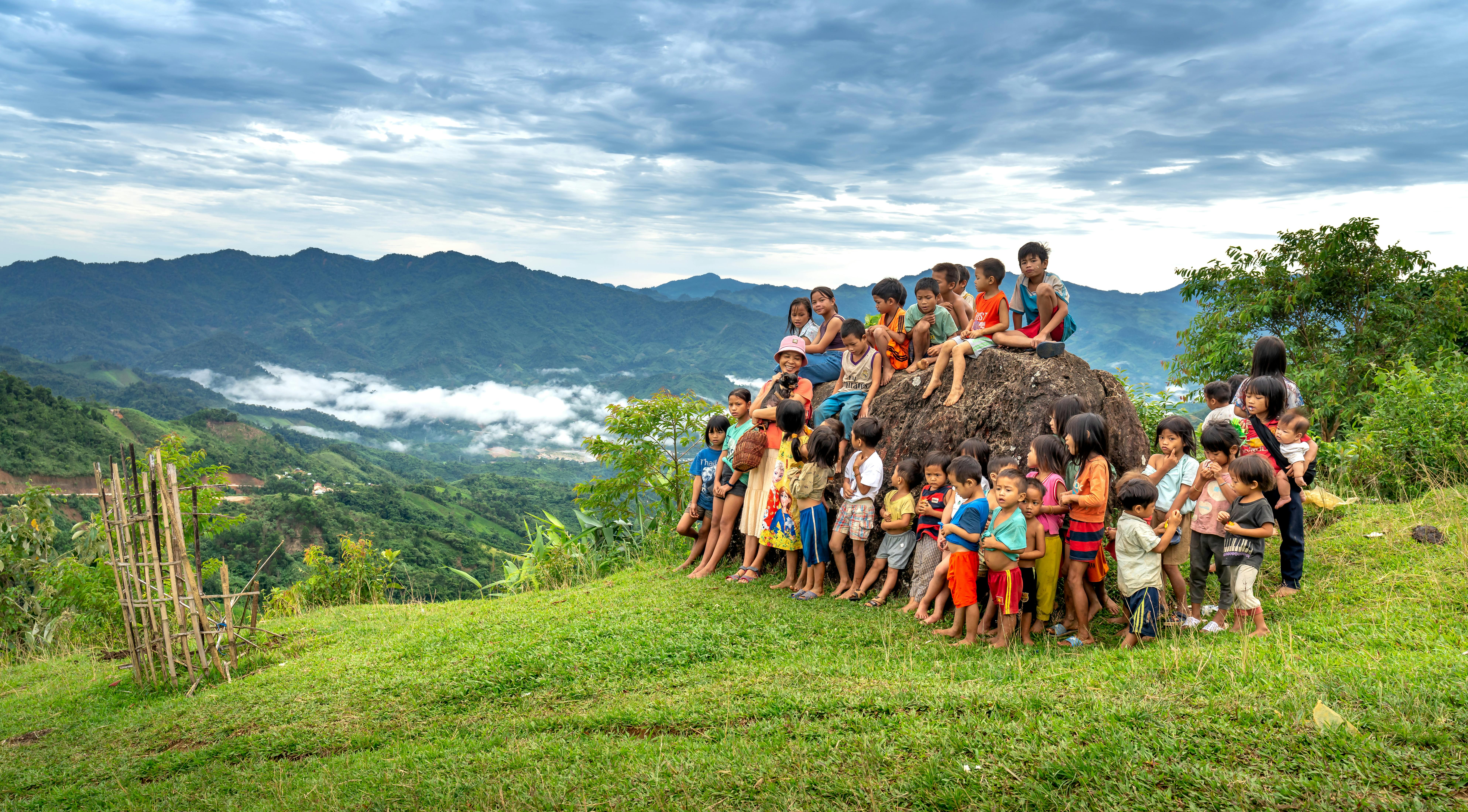 A Group of Happy Children Standing Outside · Free Stock Photo