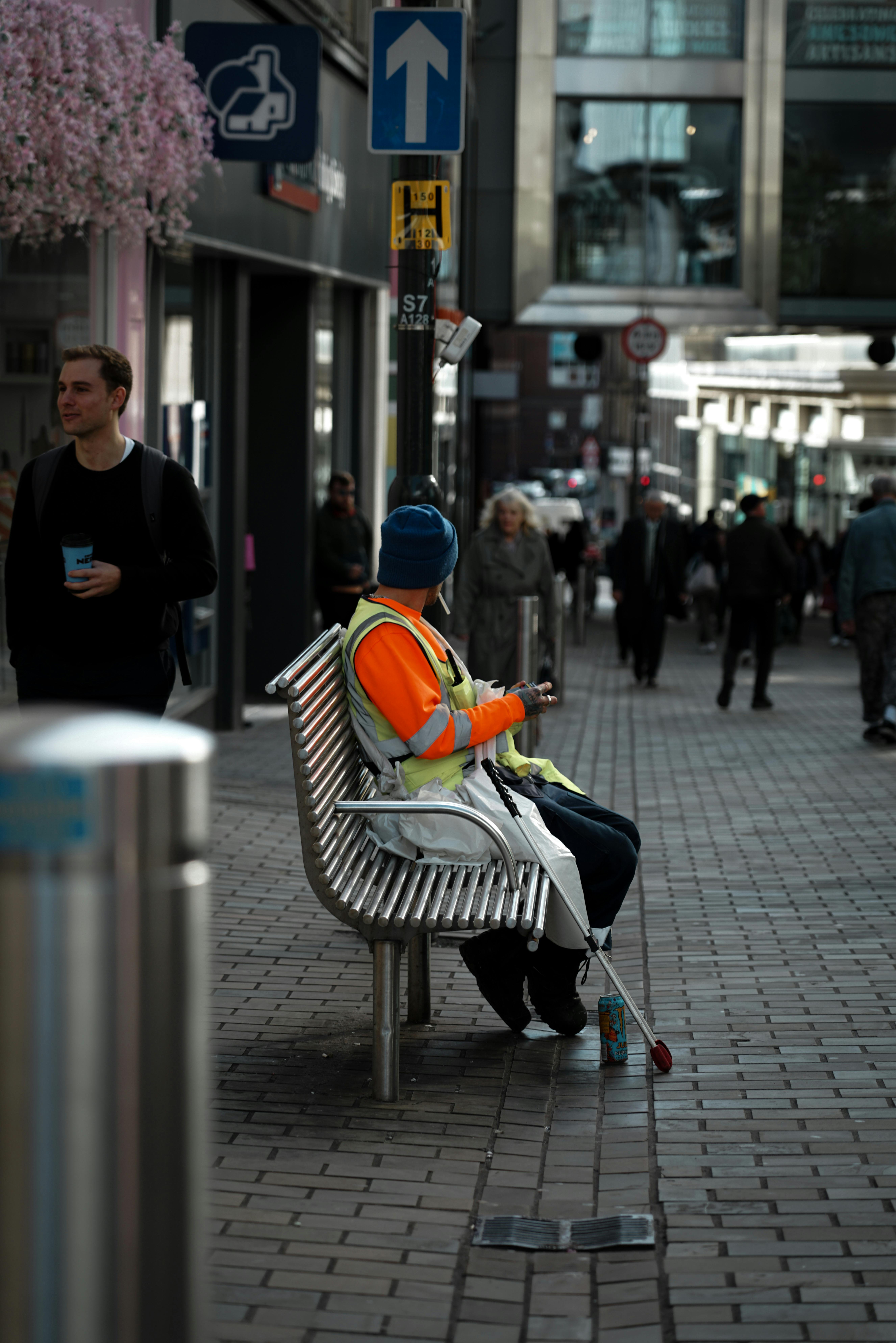A Worker Sitting on a Bench · Free Stock Photo