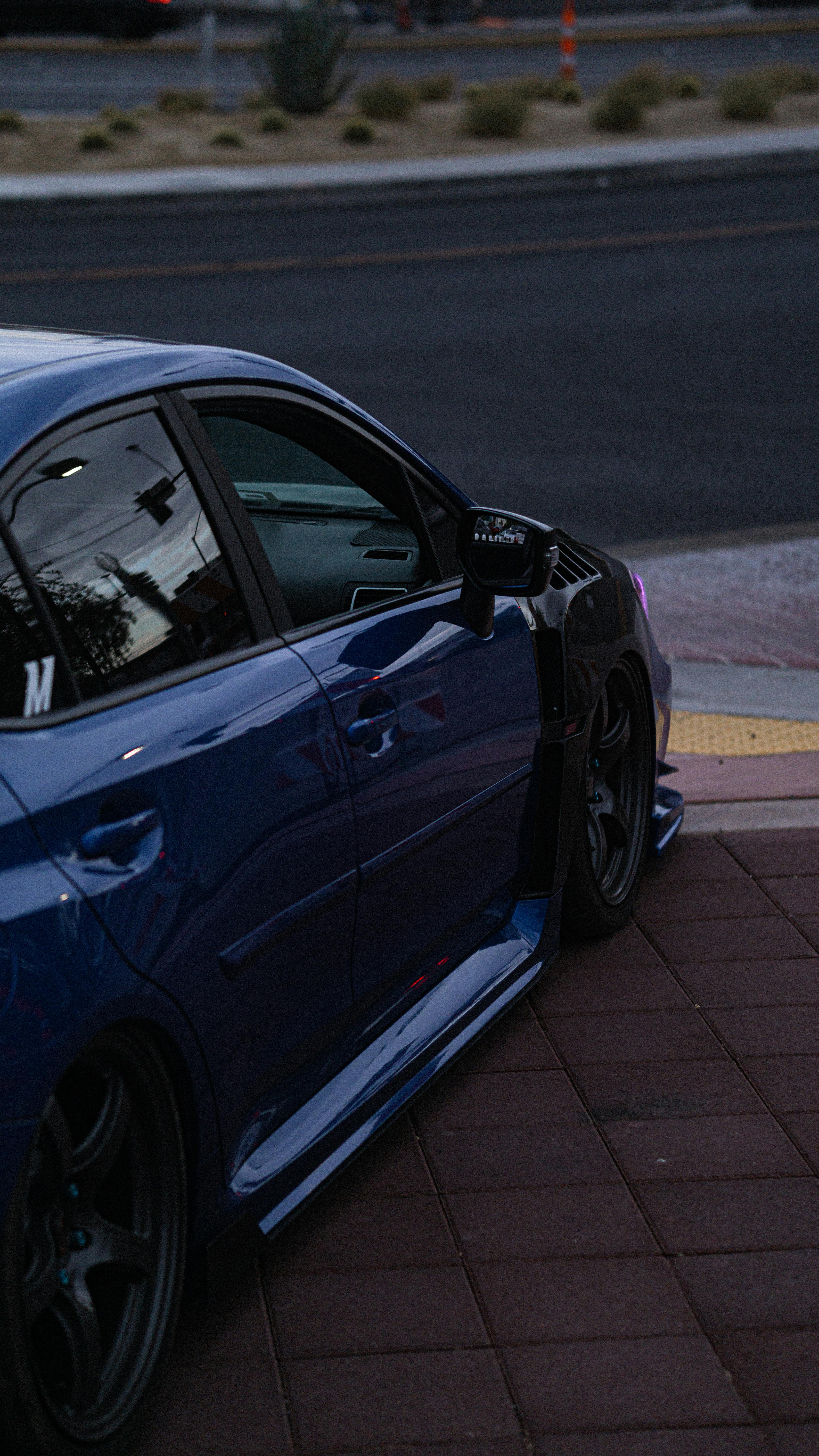 Blue Car Parked on Pavement · Free Stock Photo