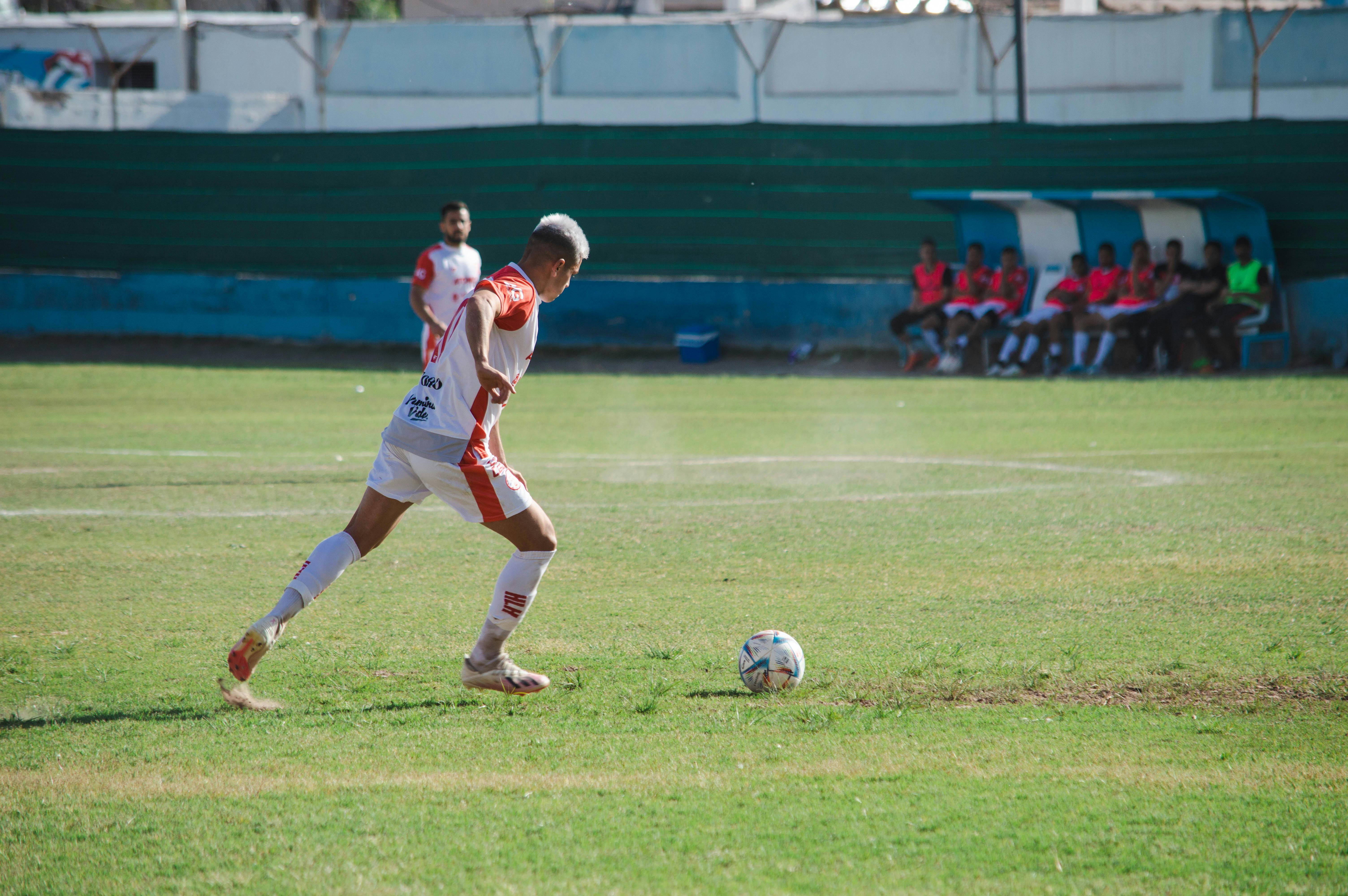 Men Playing Soccer On Green Grass Field · Free Stock Photo