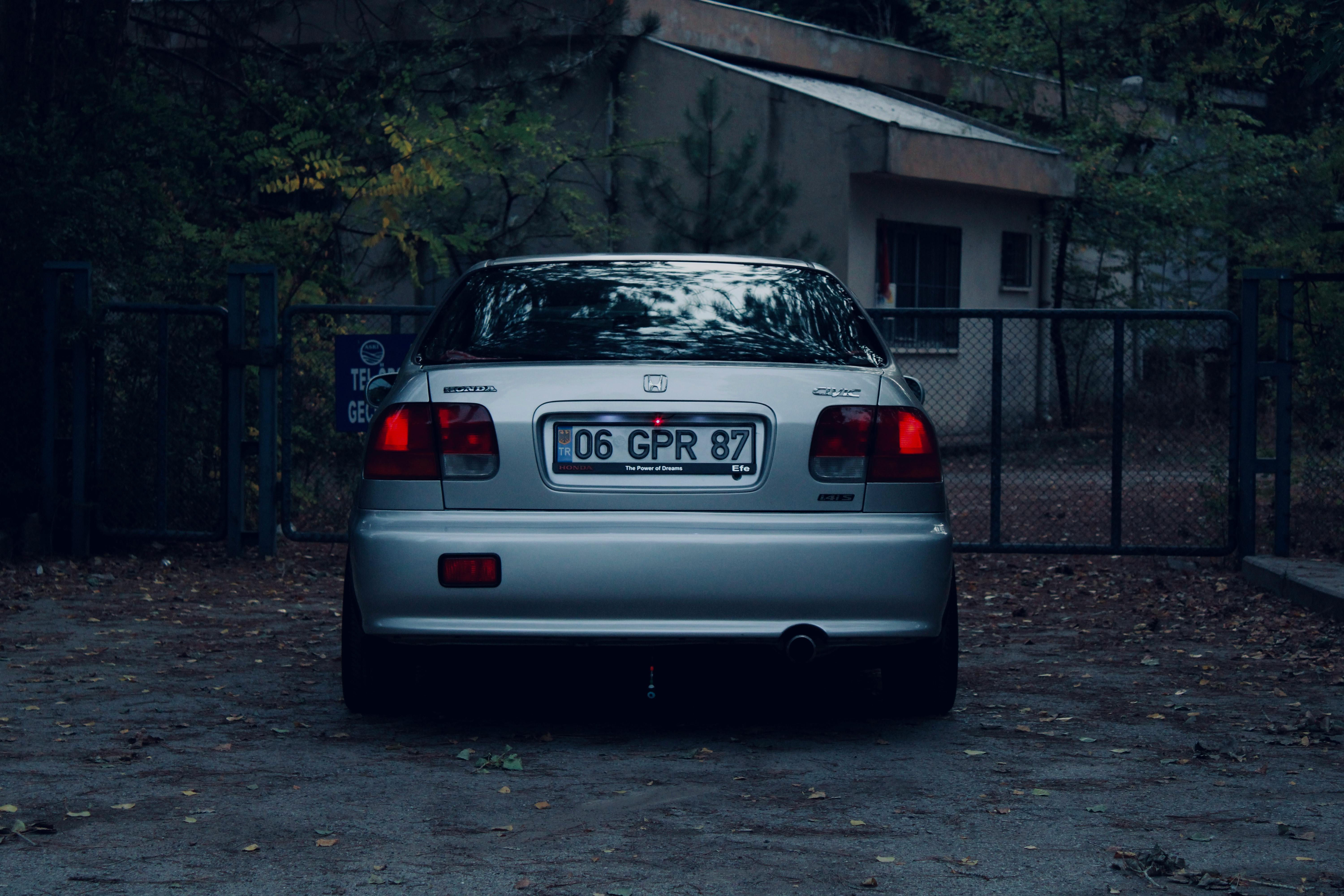 A Car with Tail Lights On · Free Stock Photo