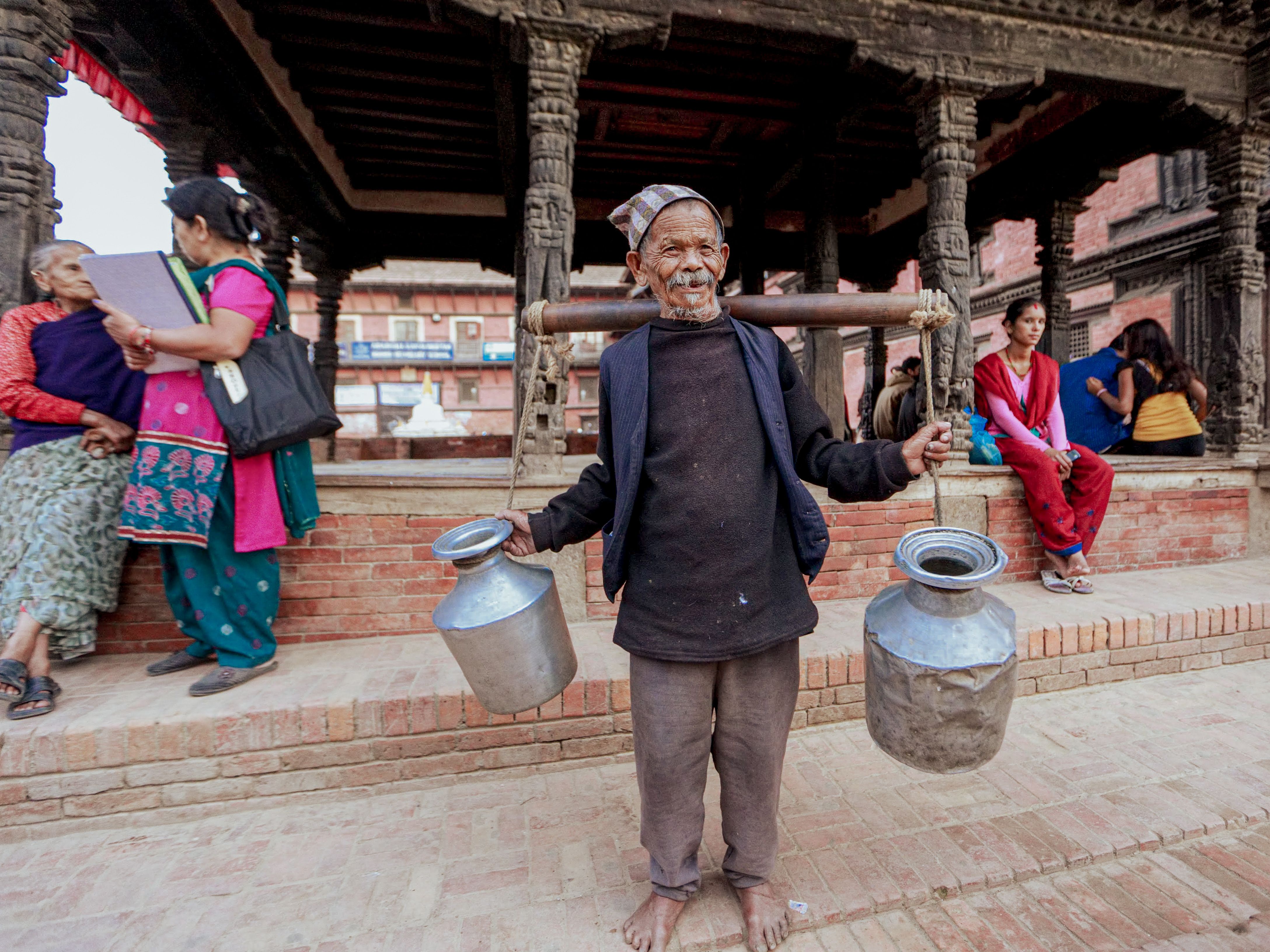 Man Carrying Pole Photos, Download The BEST Free Man Carrying Pole ...