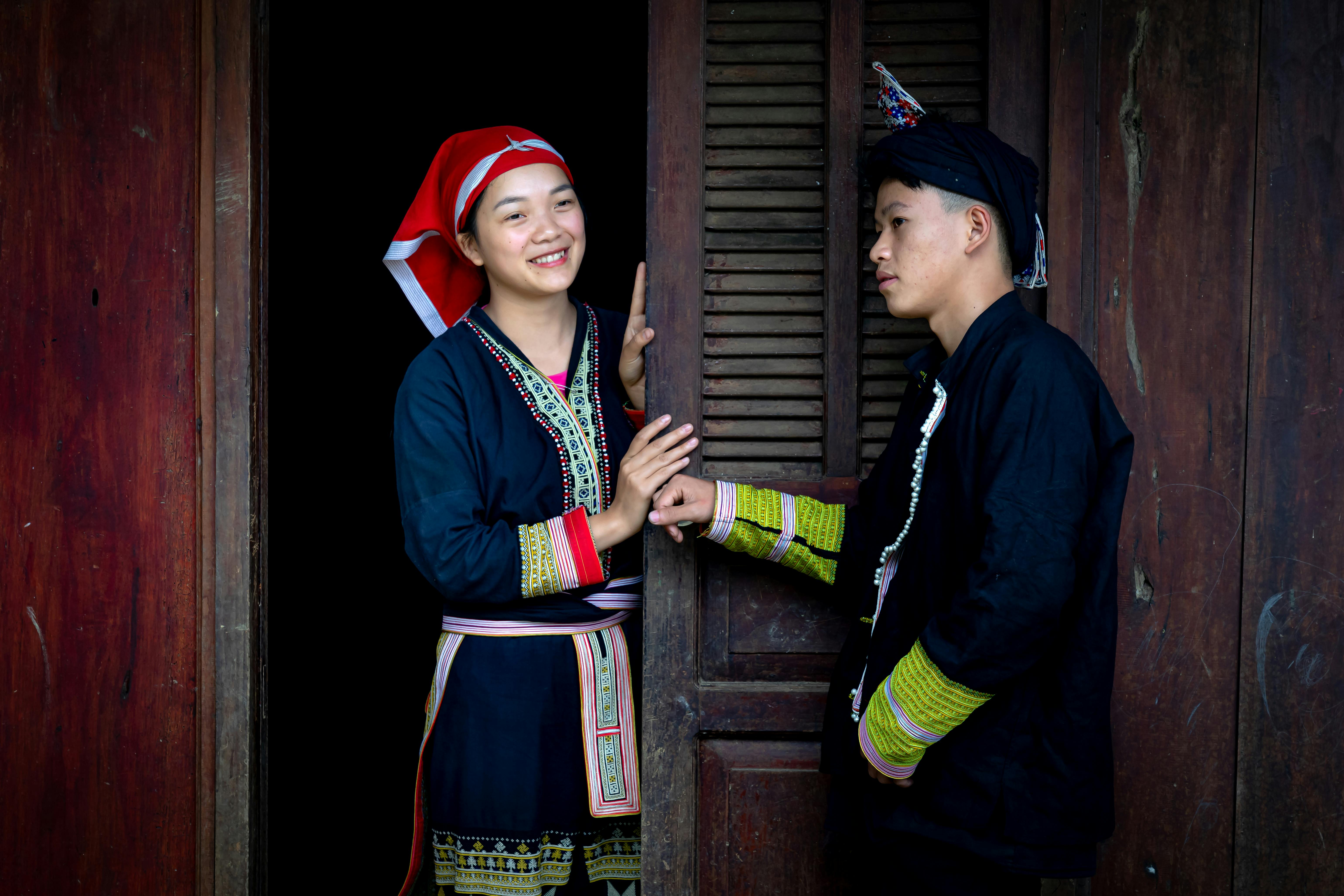 Embracing Couple in Traditional Clothing · Free Stock Photo